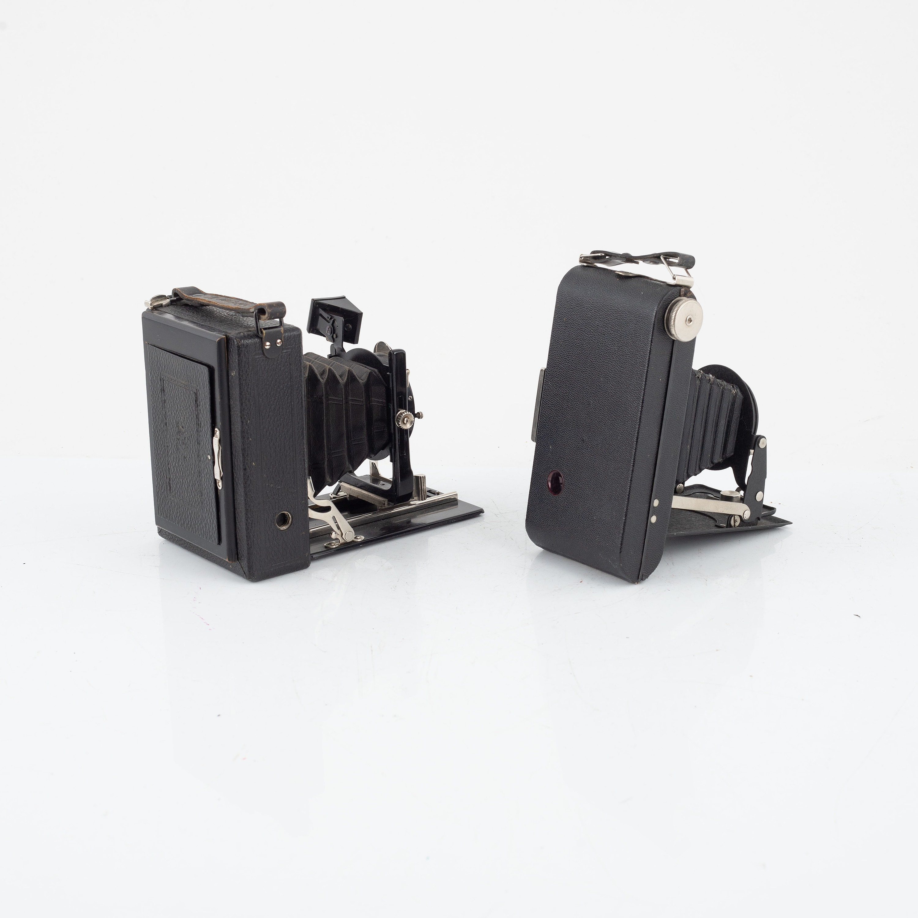 A pair of 1930s cameras, one Kodak Folding Brownie Six-20 and an Ica ...