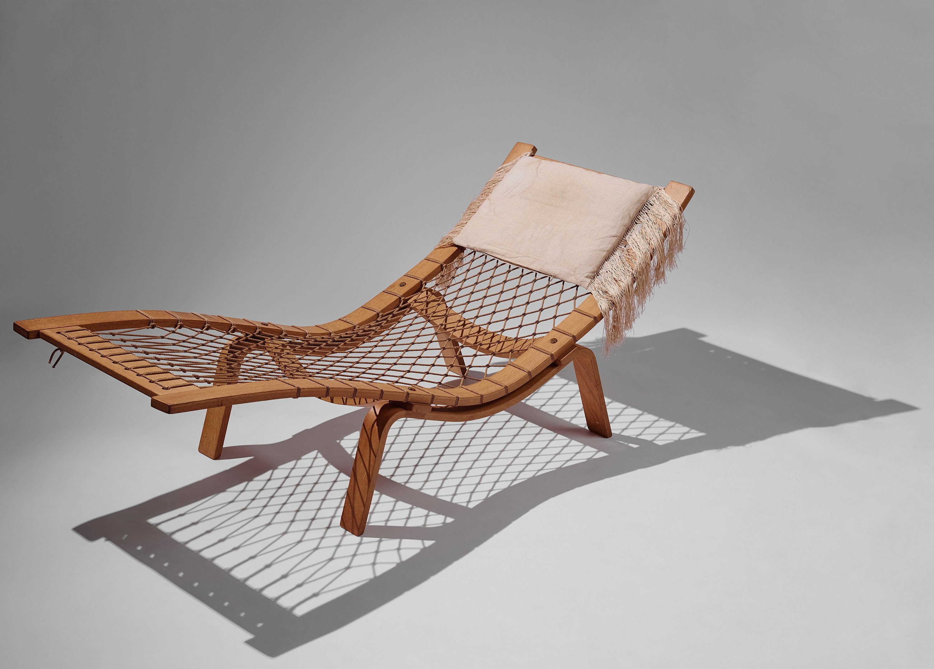 Hans J. Wegner, an oak chaise longue 'Hammock Chair GE2', Getama ...