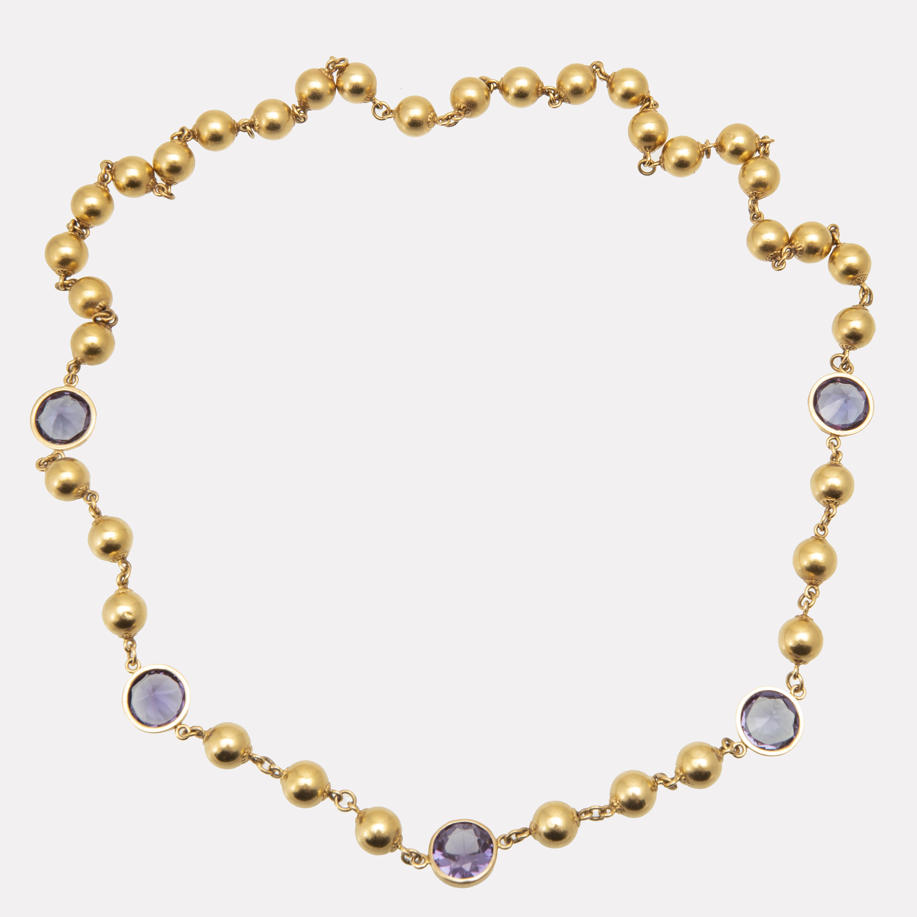 Halsband 14K guld och lila syntetiska safirer. - Bukowskis