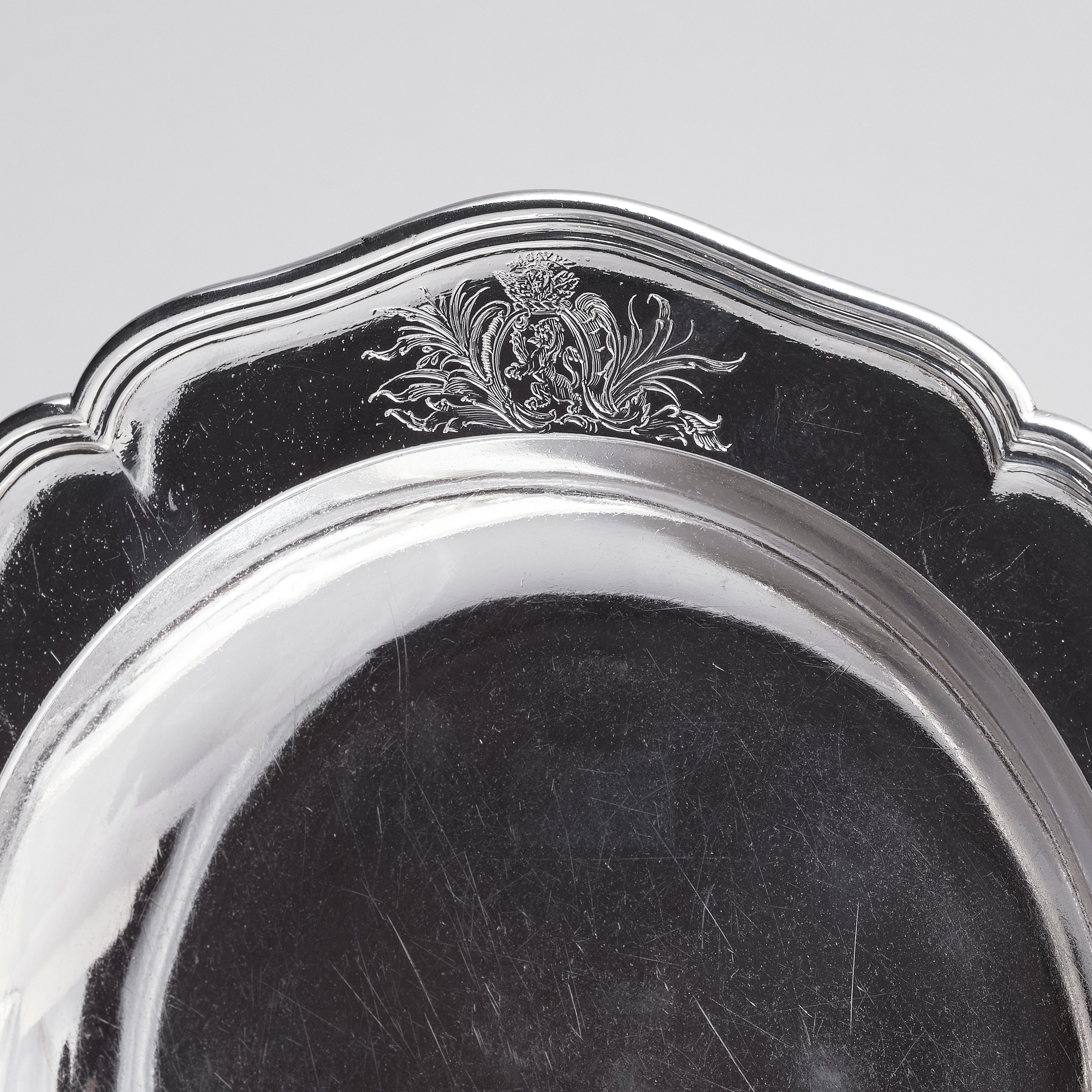 A set of eight English 18th century silver dinner-plates, mark of ...