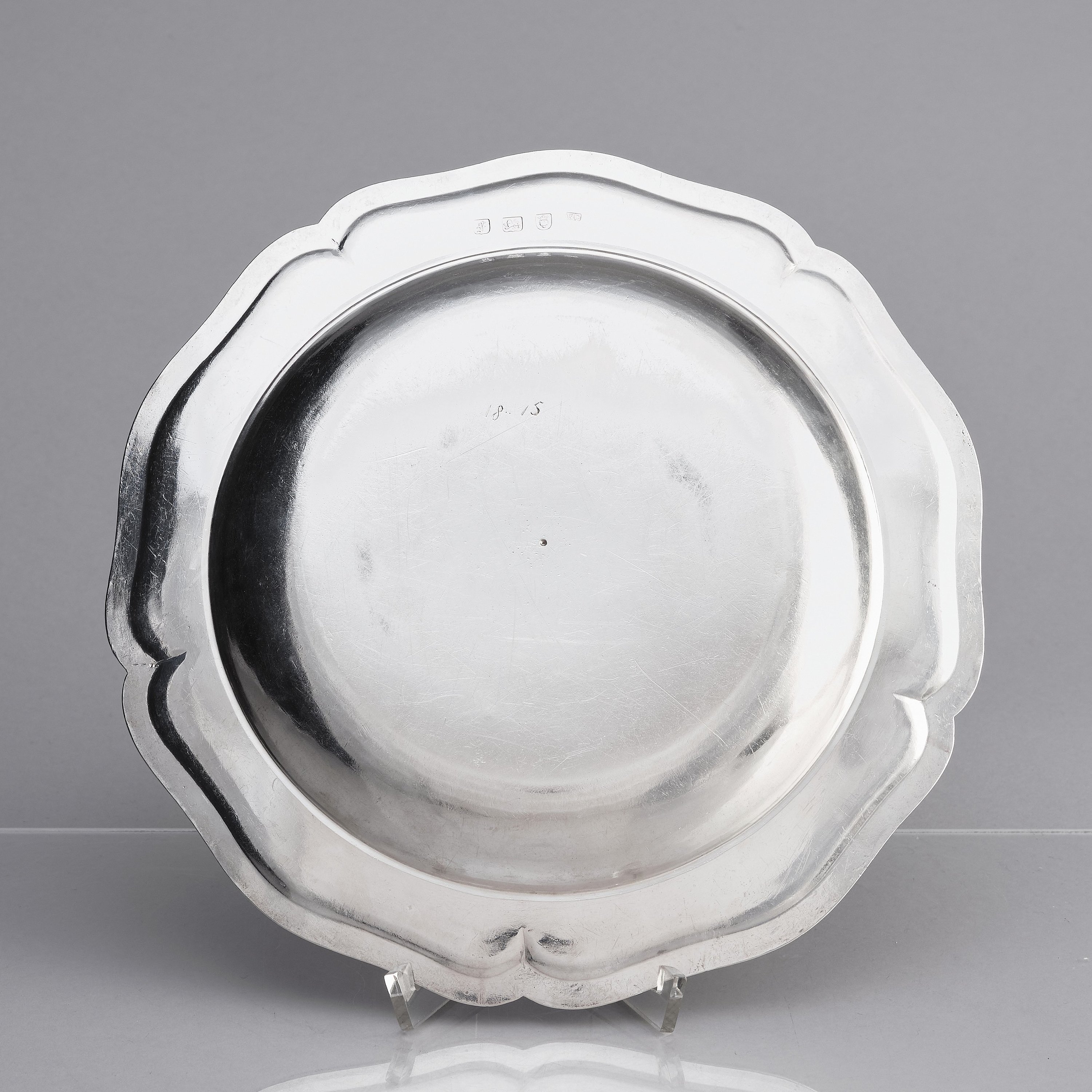A set of eight English 18th century silver dinner-plates, mark of ...