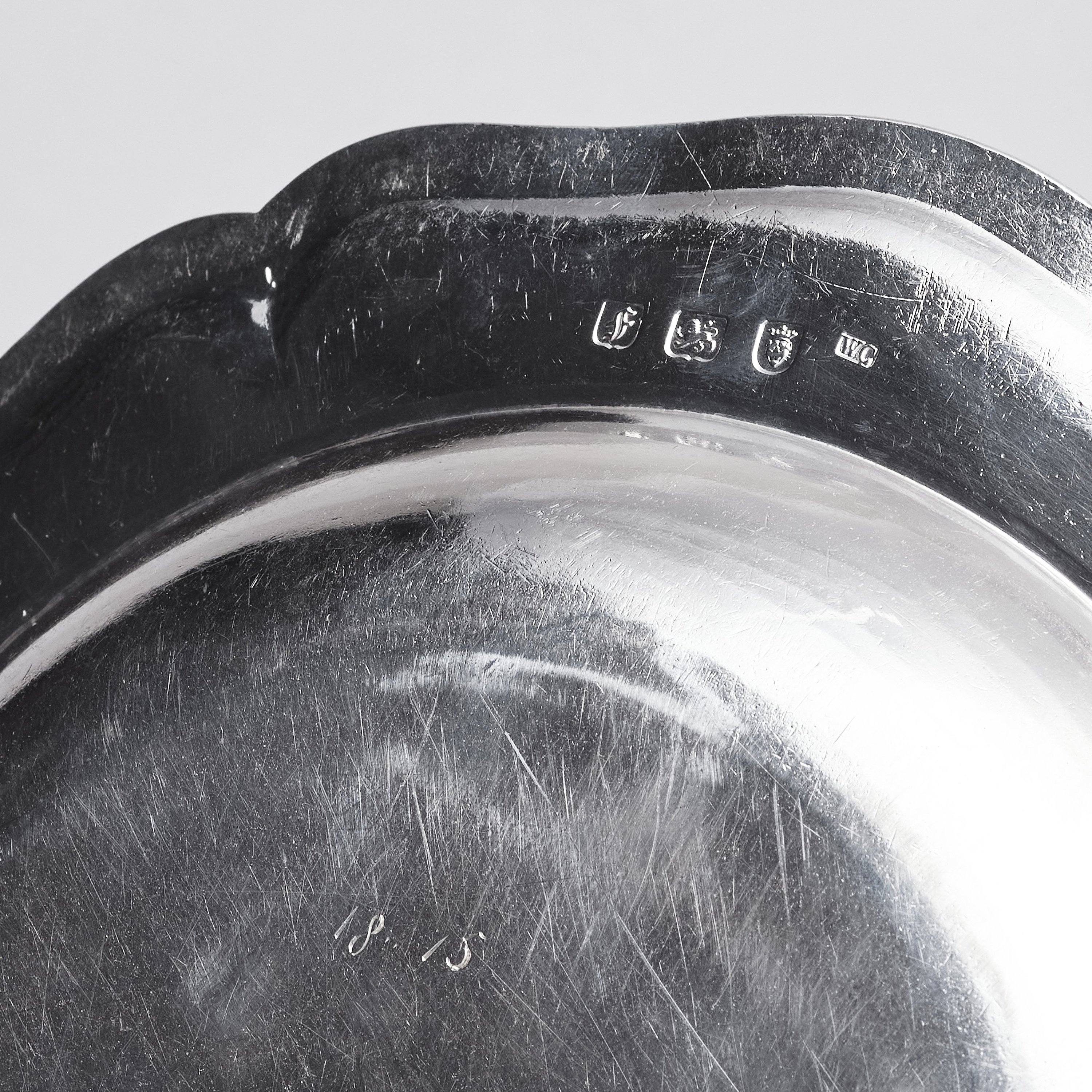 A set of eight English 18th century silver dinner-plates, mark of ...