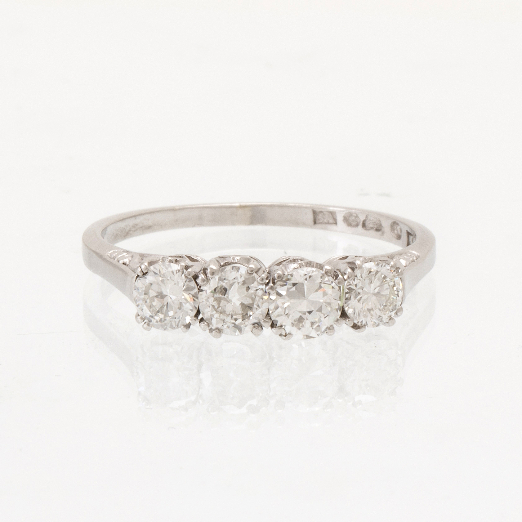 A platinum ring set with round brilliant-cut and old-cut diamonds ...