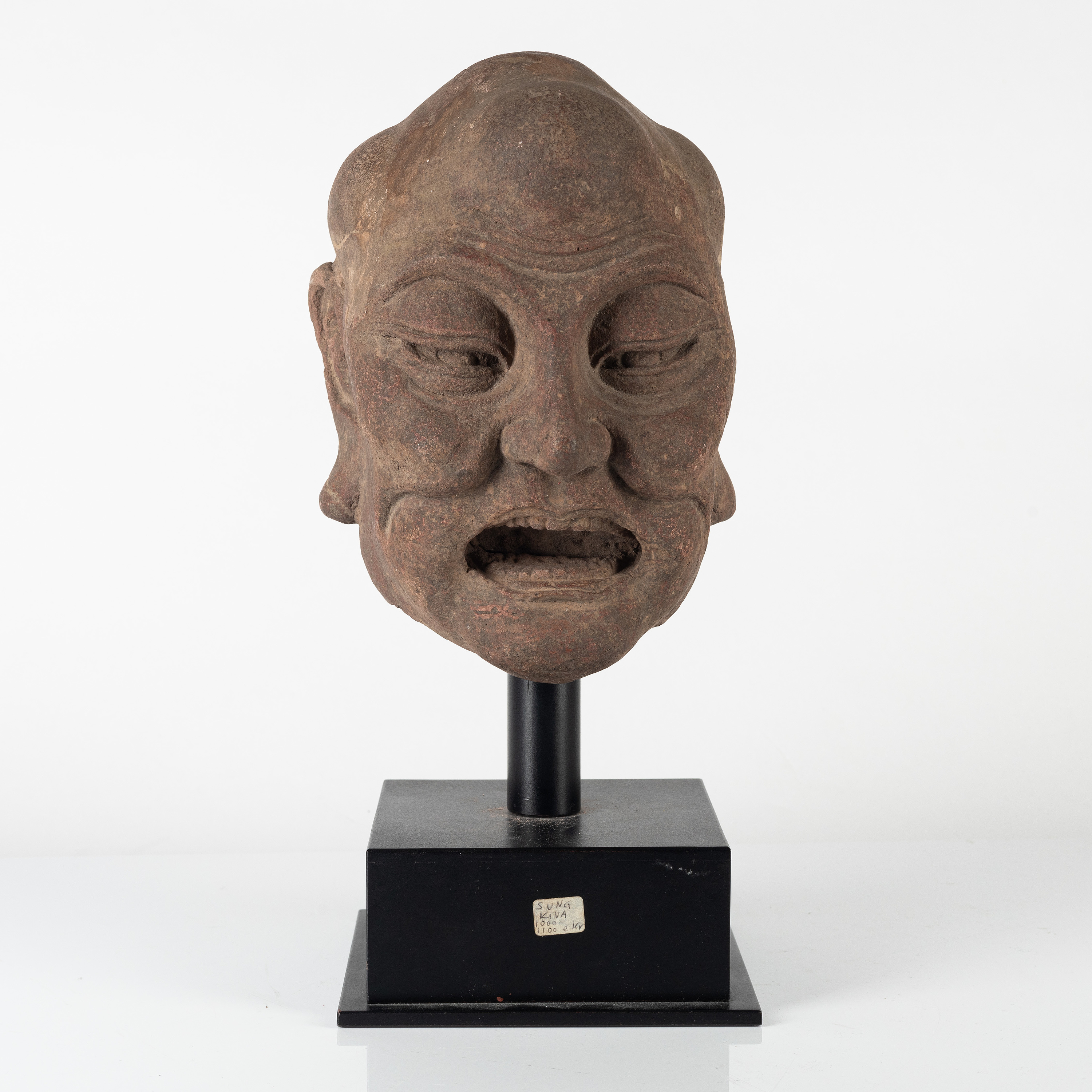 A carved stone head of a Luohan, Ming style but later. - Bukowskis