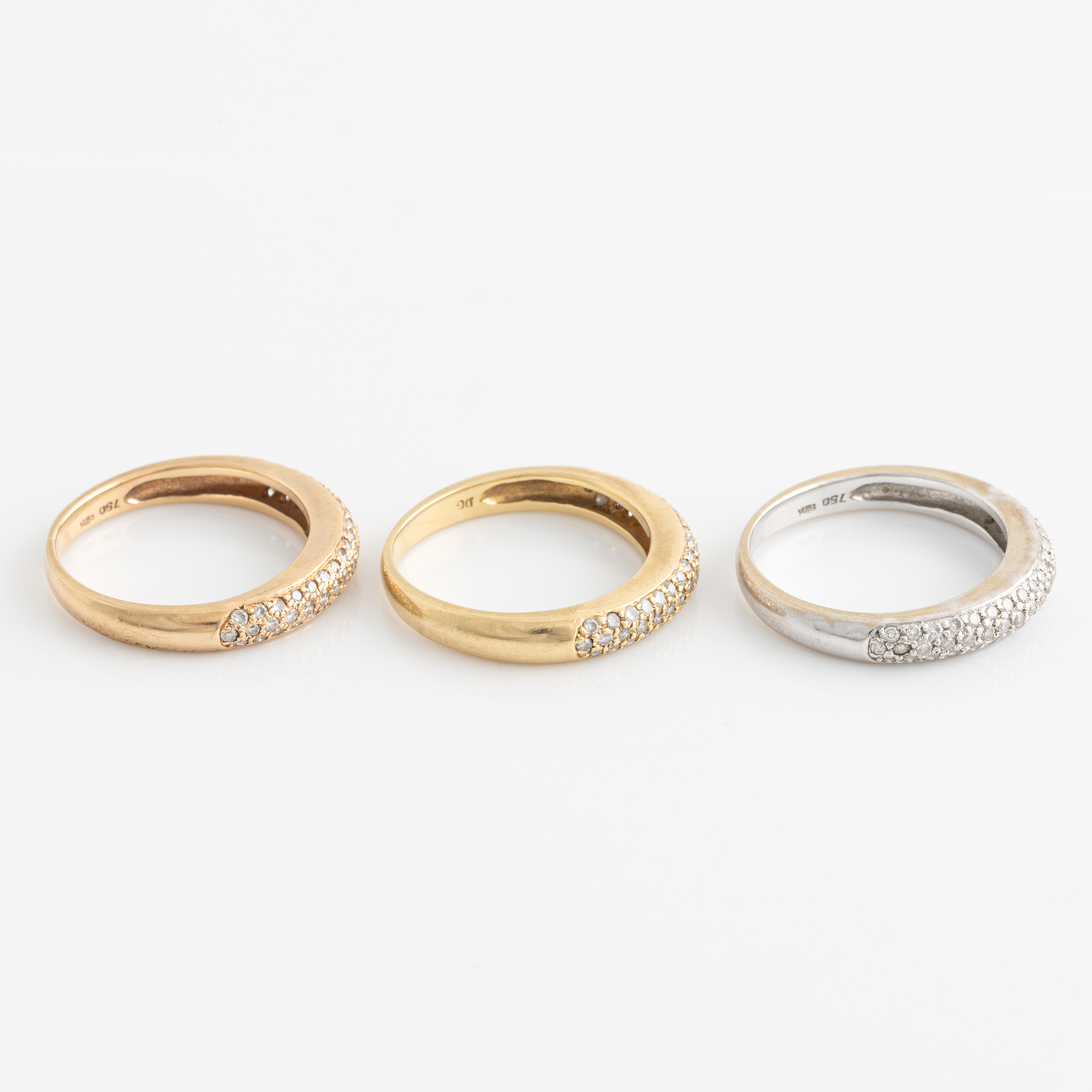 Three 18K gold rings with round brilliant-cut diamonds. - Bukowskis