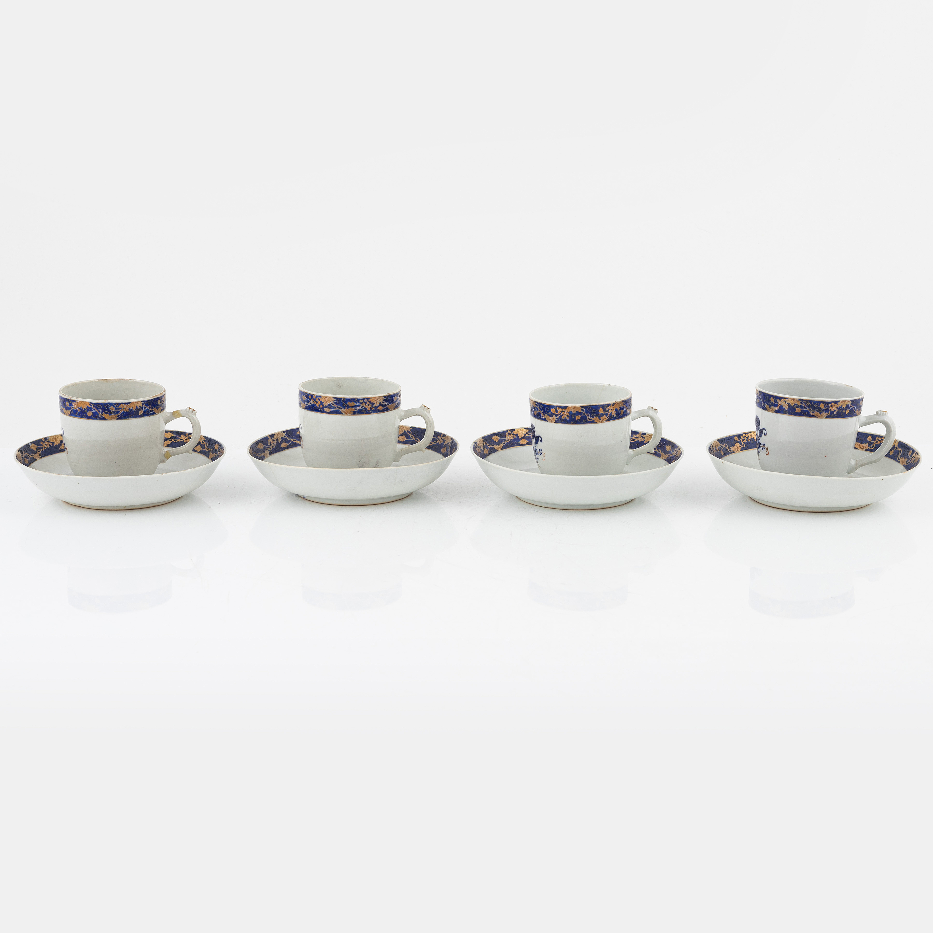 A group of four Chinese porcelain coffee cups with saucers, Qing ...