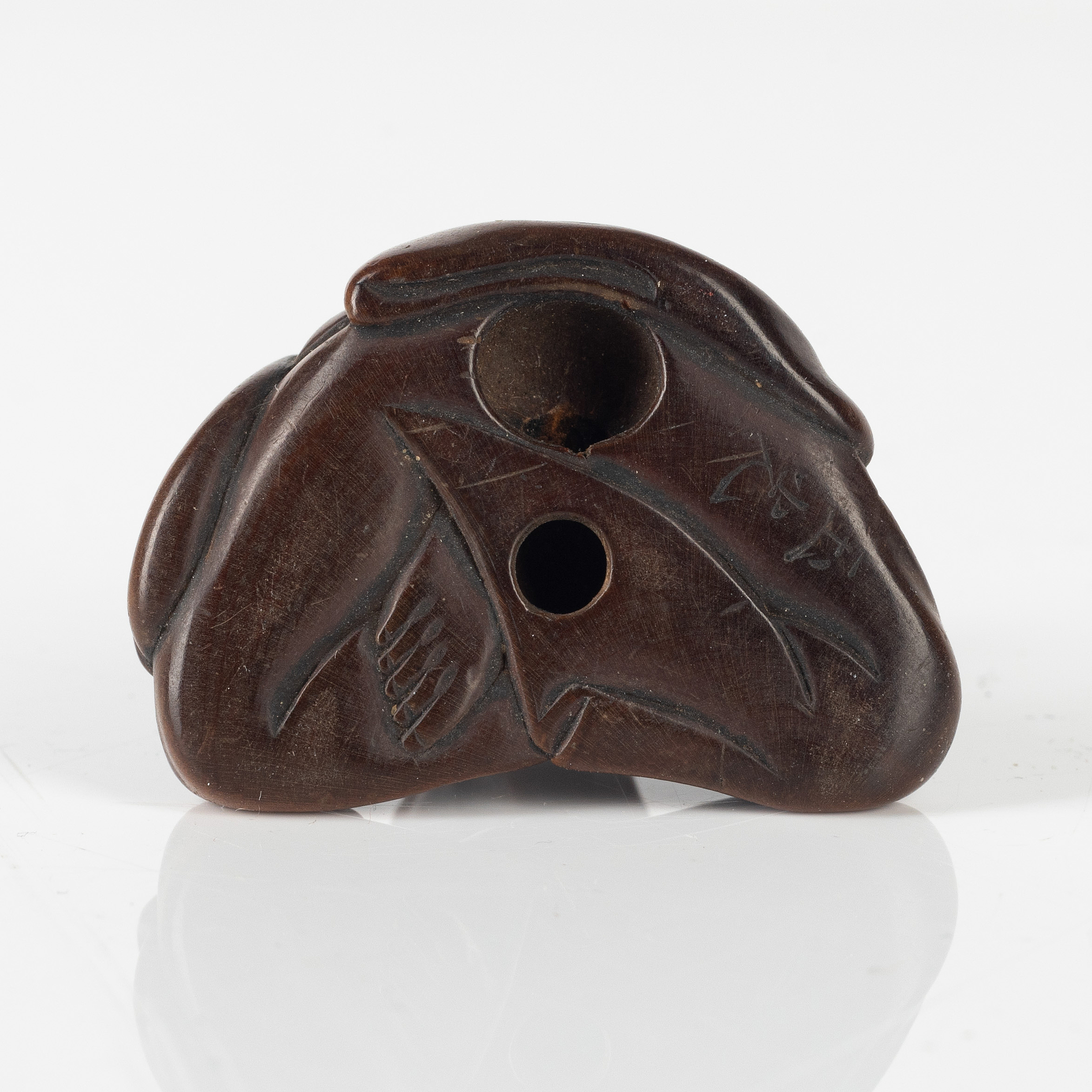 A wood netsuke of a professional sneezer, signed Gyokkō, 19th century ...