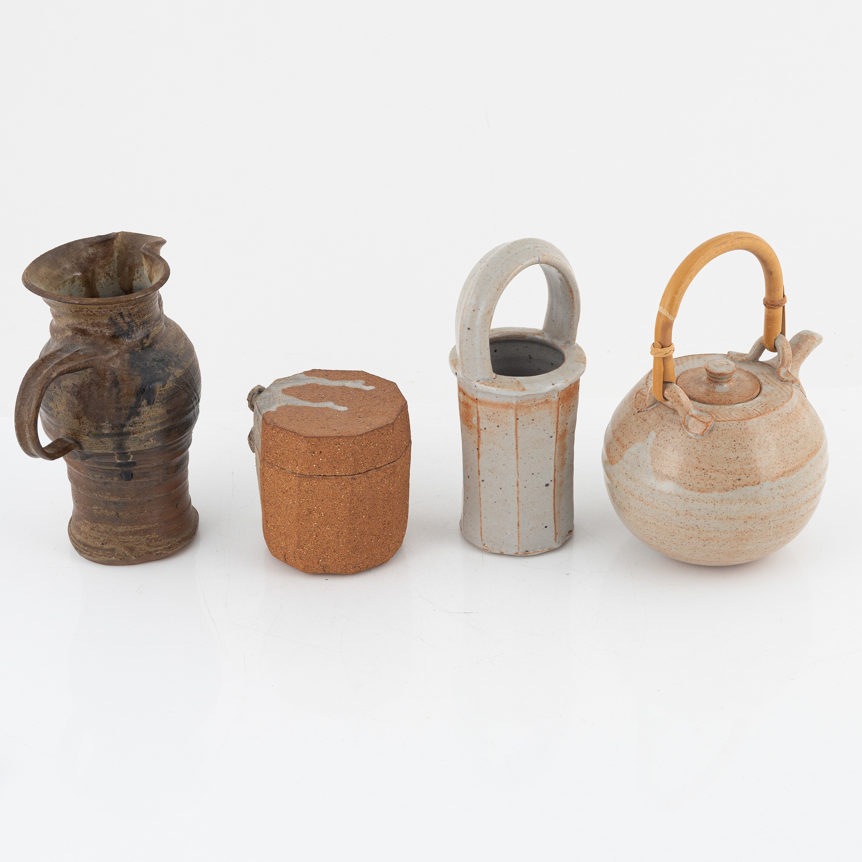 A teapot, jug, vase, bowl and urn with cover, including Johan Thunell ...