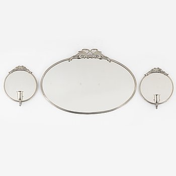 A Swedish Grace mirror and a pair of wall sconces, 1920's-30's. - Bukowskis