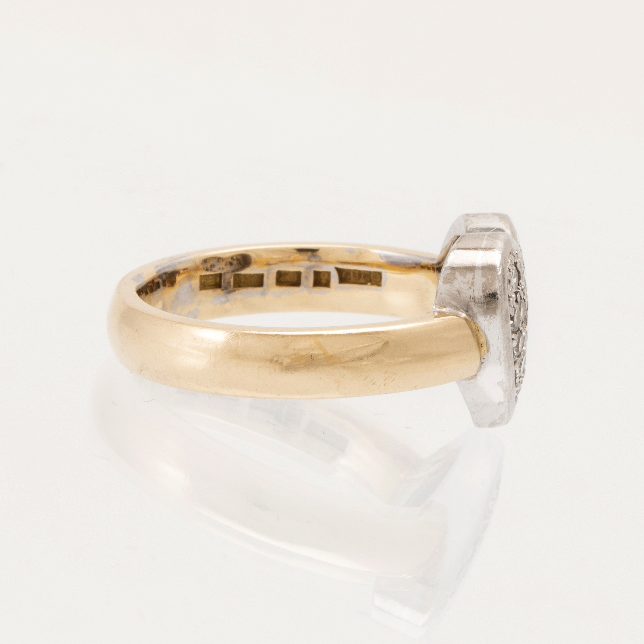 An 18K white and red gold ring set with round brilliant-cut and single ...