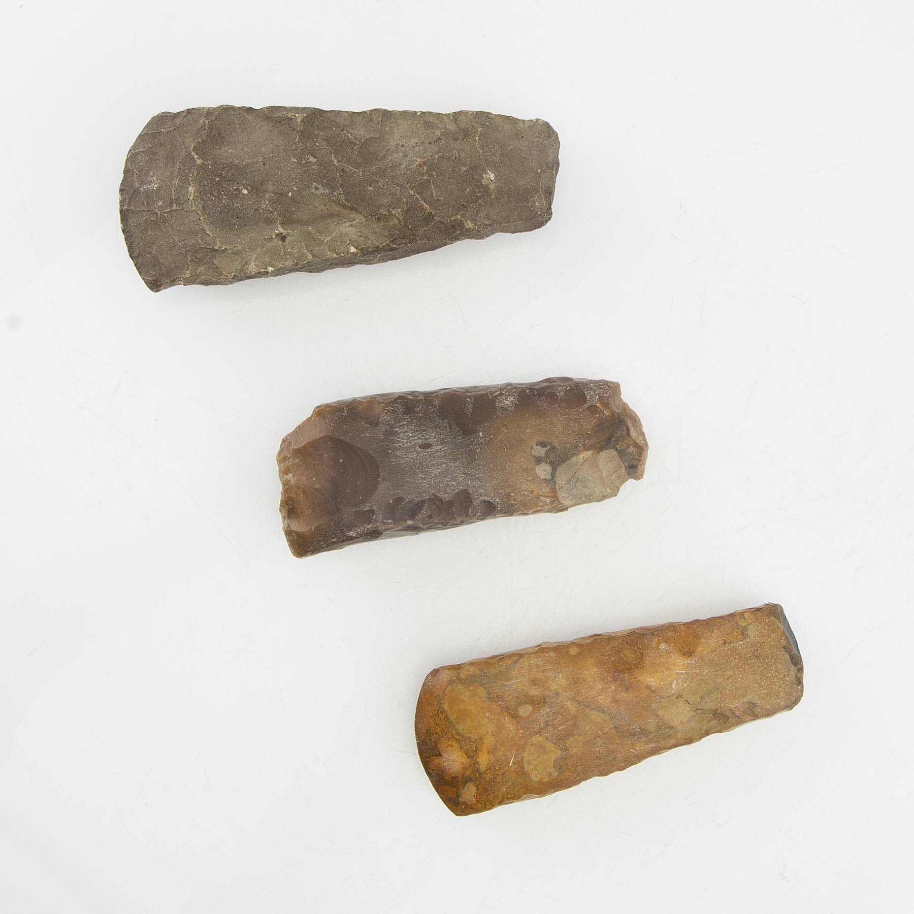 Three flint axes, Neolithic period. - Bukowskis