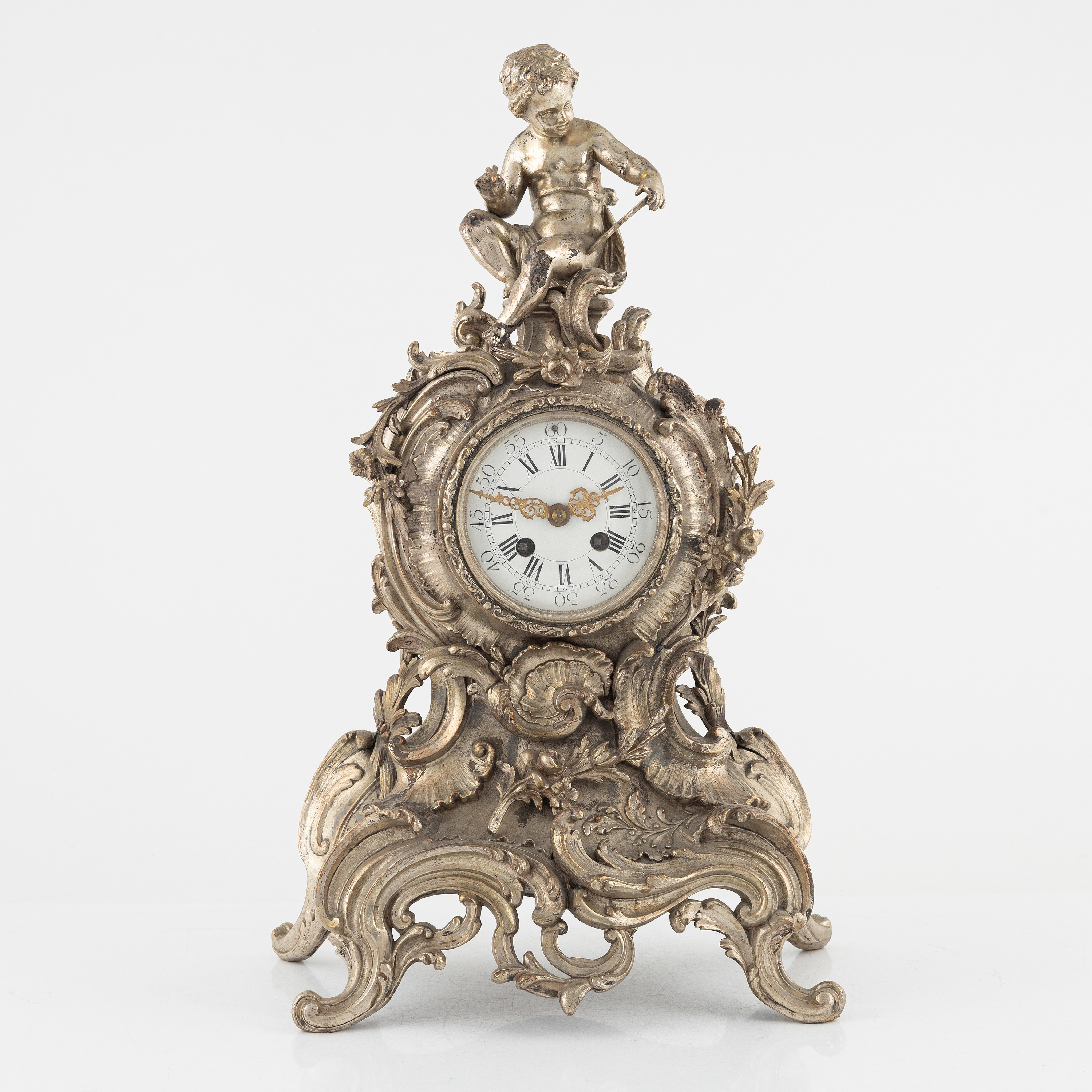 A Rococo style mantle clock, France, late 19th Century. - Bukowskis