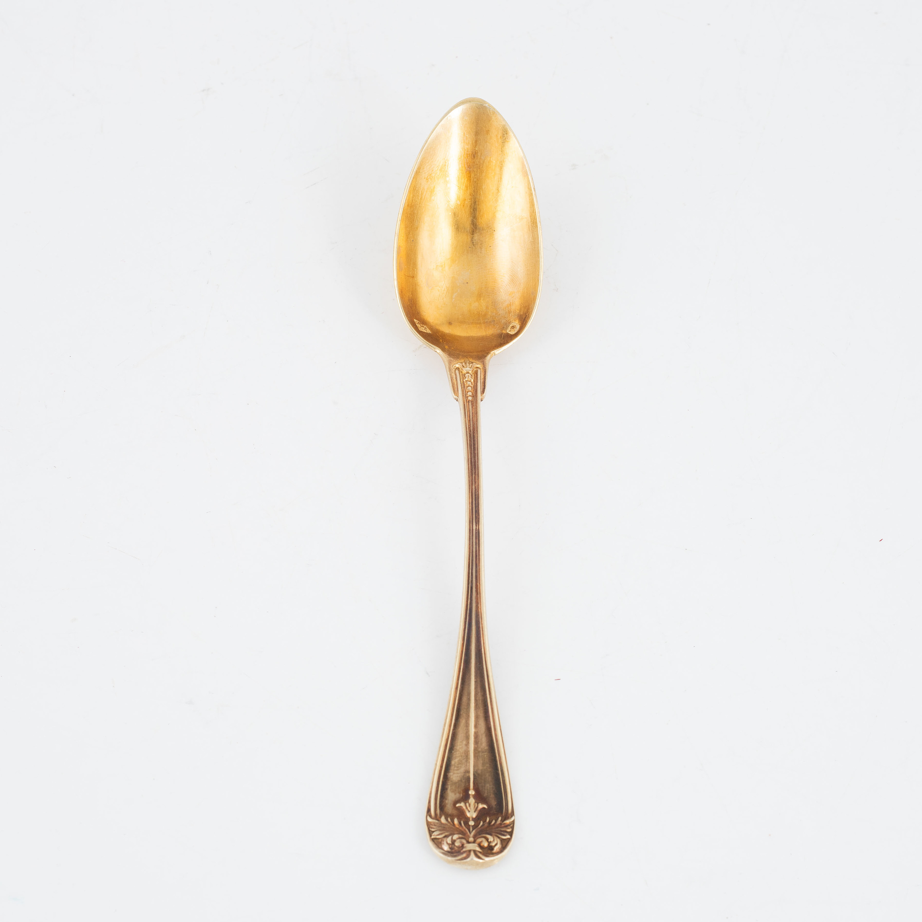 Philippe Berthier, 13 spoons, a sugar tongs and a tea strainer, gilded ...