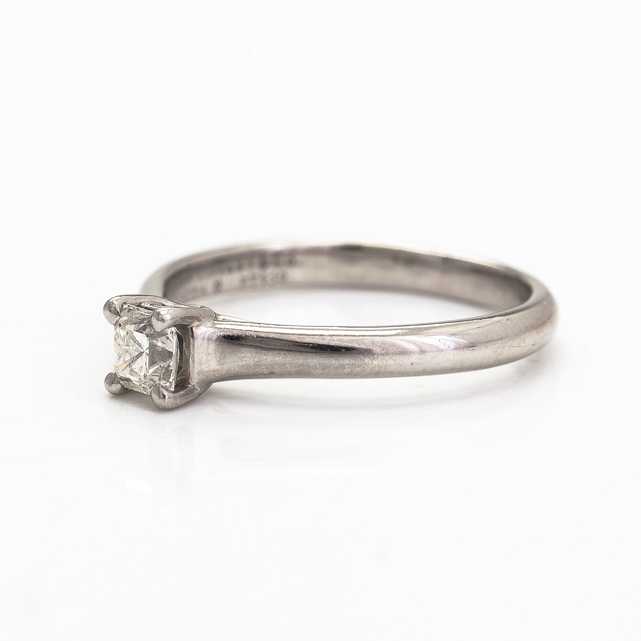 Tiffany & Co, a platinum 'Lucida' ring, with a square mixed-cut diamond ...