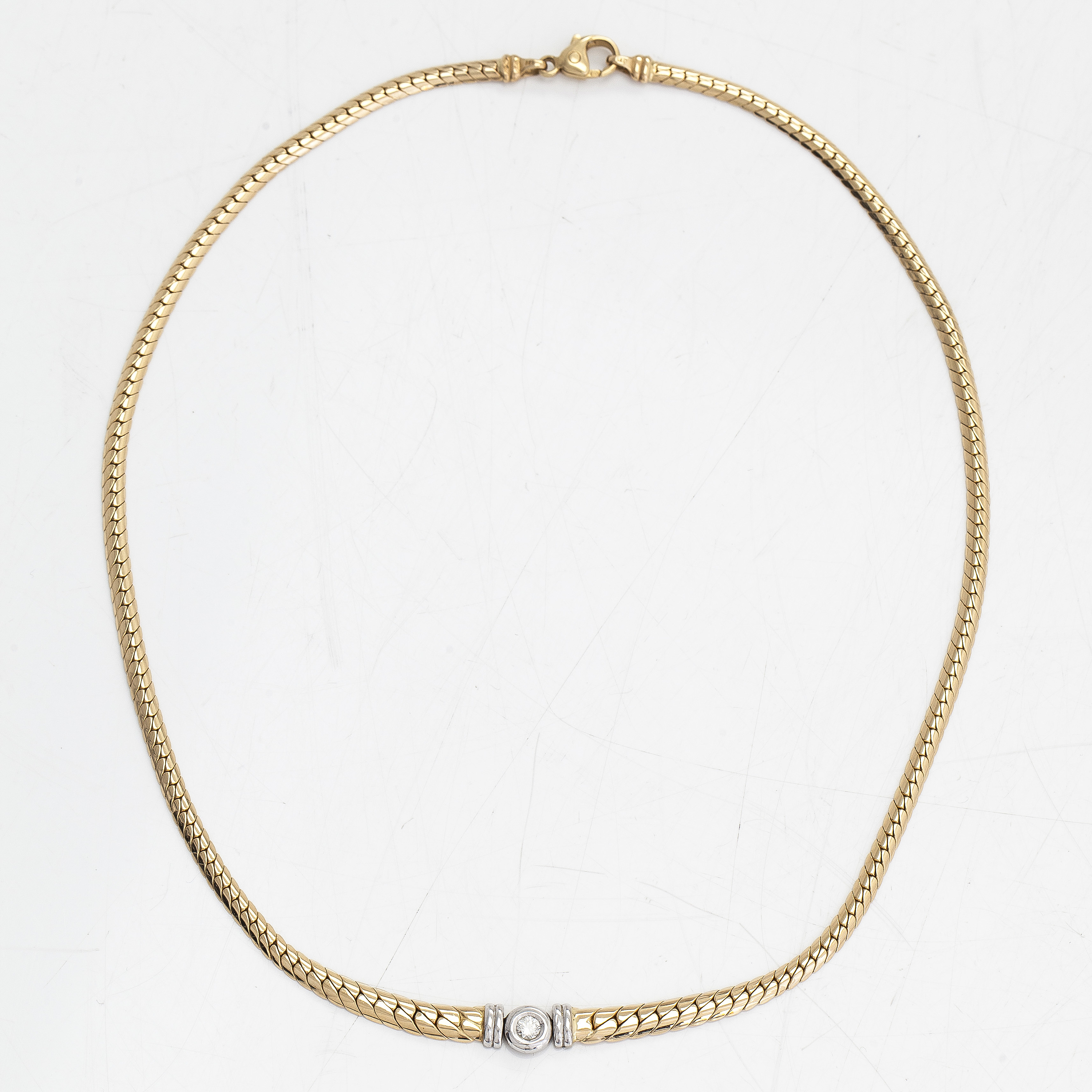 Necklace, 14K gold, with a brilliant-cut diamond approximately 0.15 ct ...