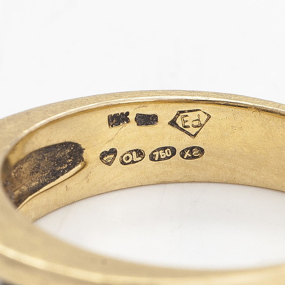 An 18K gold ring, diamonds totalling approx. 0.26 ct and sapphires ...