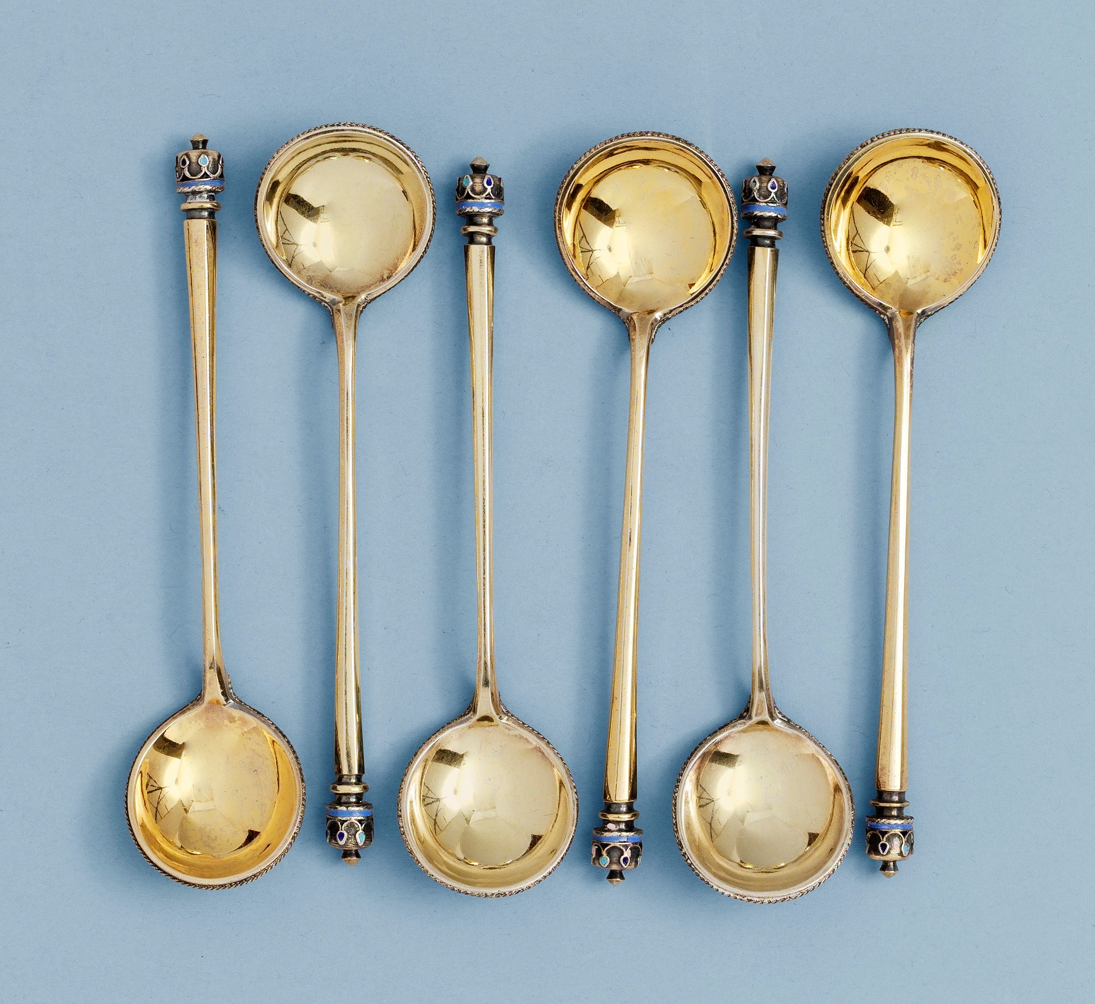 A SET OF SIX RUSSIAN SILVER AND ENAMEL TEA-SPOONS, makers mark of Ivan ...