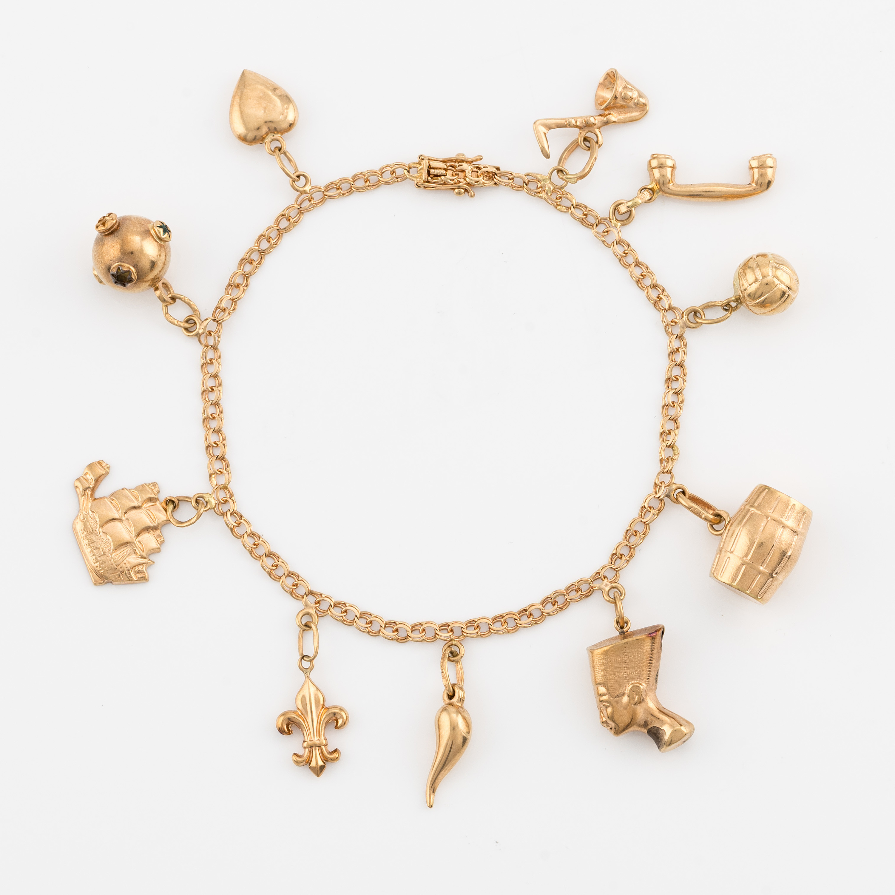 Armband, 18K guld, med berlocker. - Bukowskis