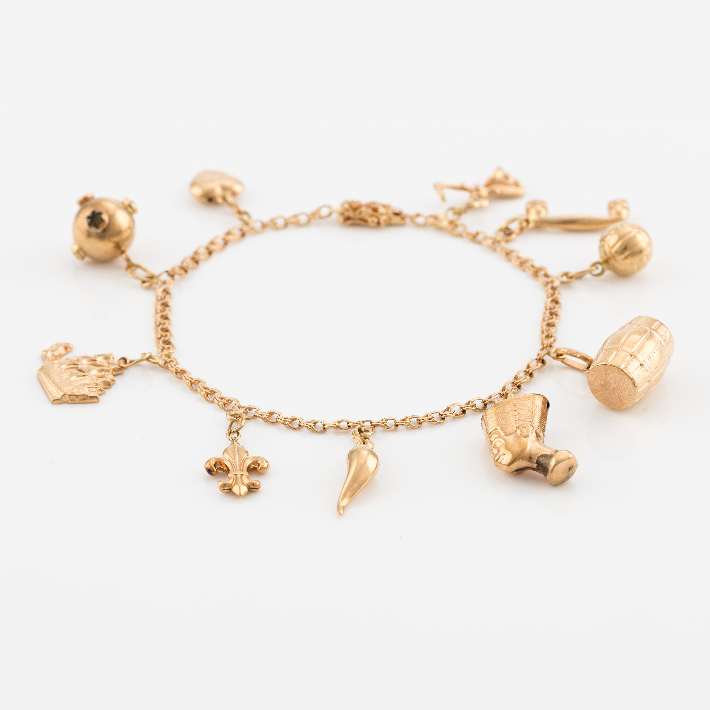 Armband, 18K guld, med berlocker. - Bukowskis