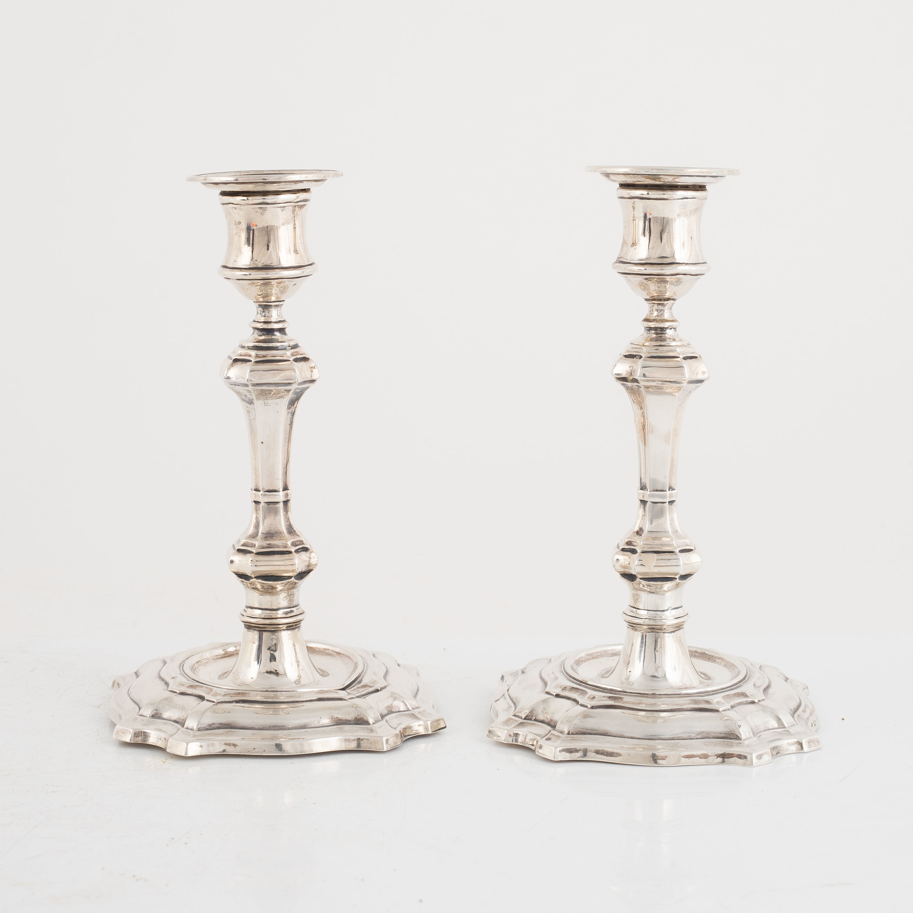 A pair of silver candlesticks, makr of William Hutton & Sons Ltd ...