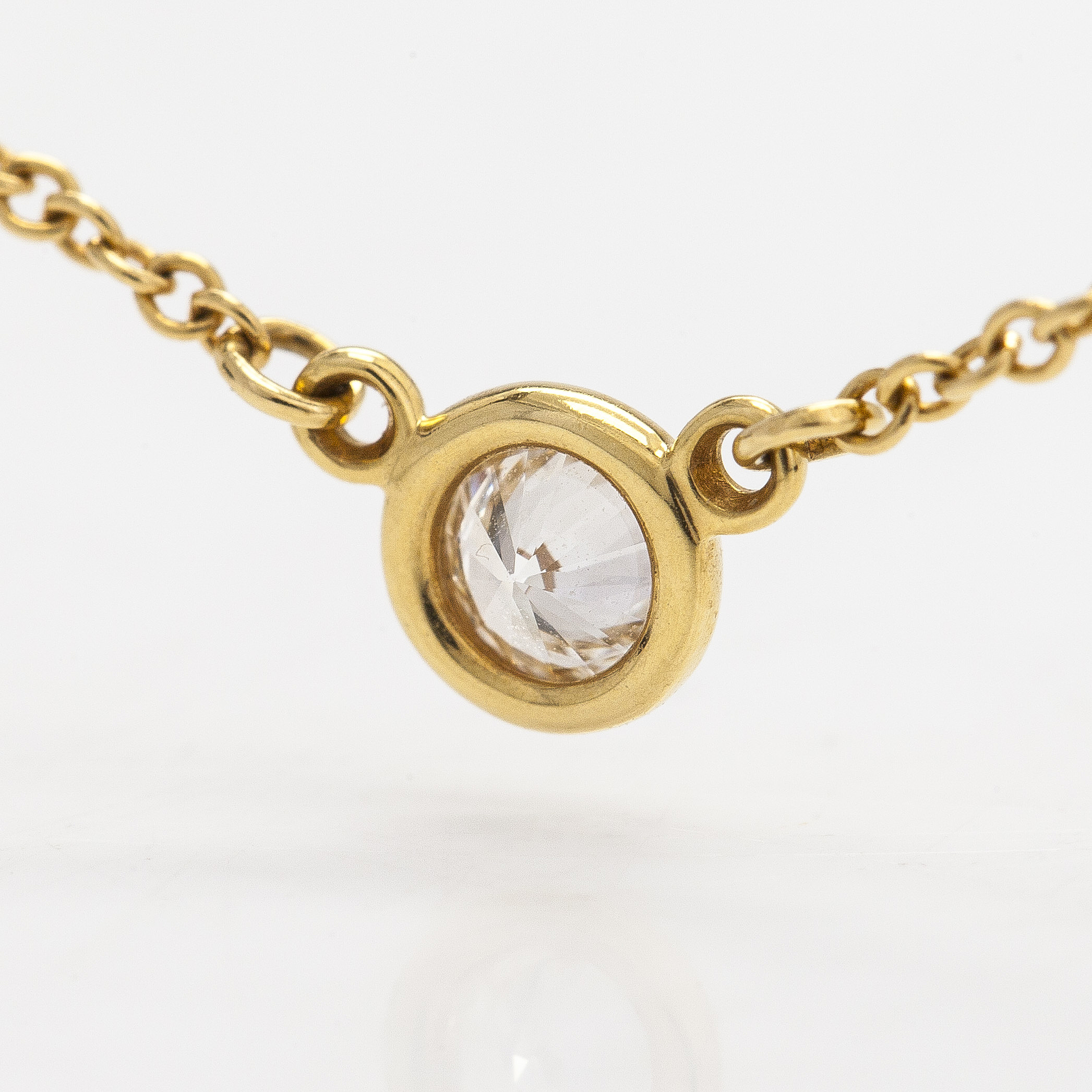 Tiffany & Co, Elsa Peretti, halsband, 18K guld och diamant ca 0.12 ct. - Bukowskis