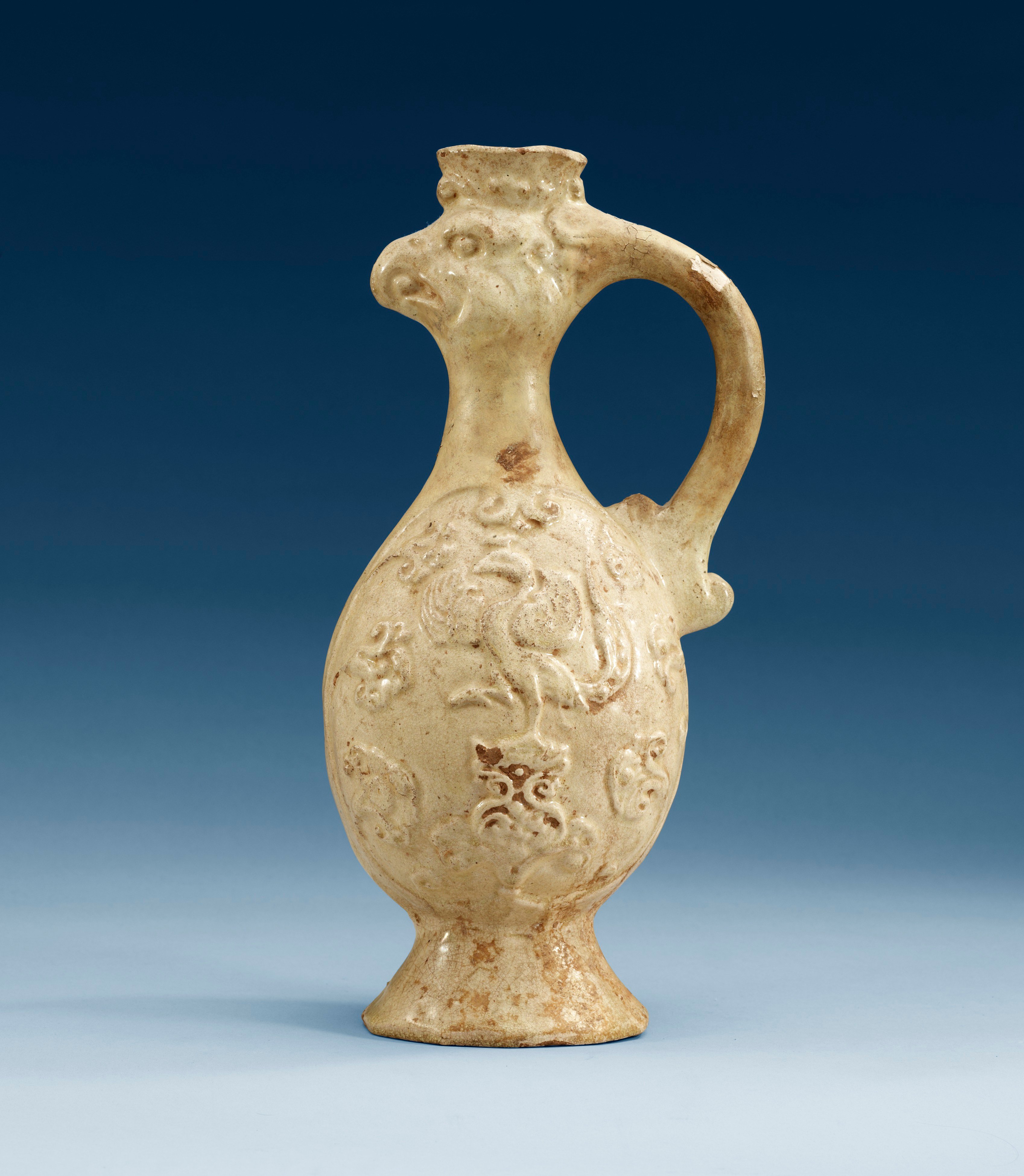 A cream-glazed pottery Phoenix-head ewer, Tang dynasty (618-907 AD ...