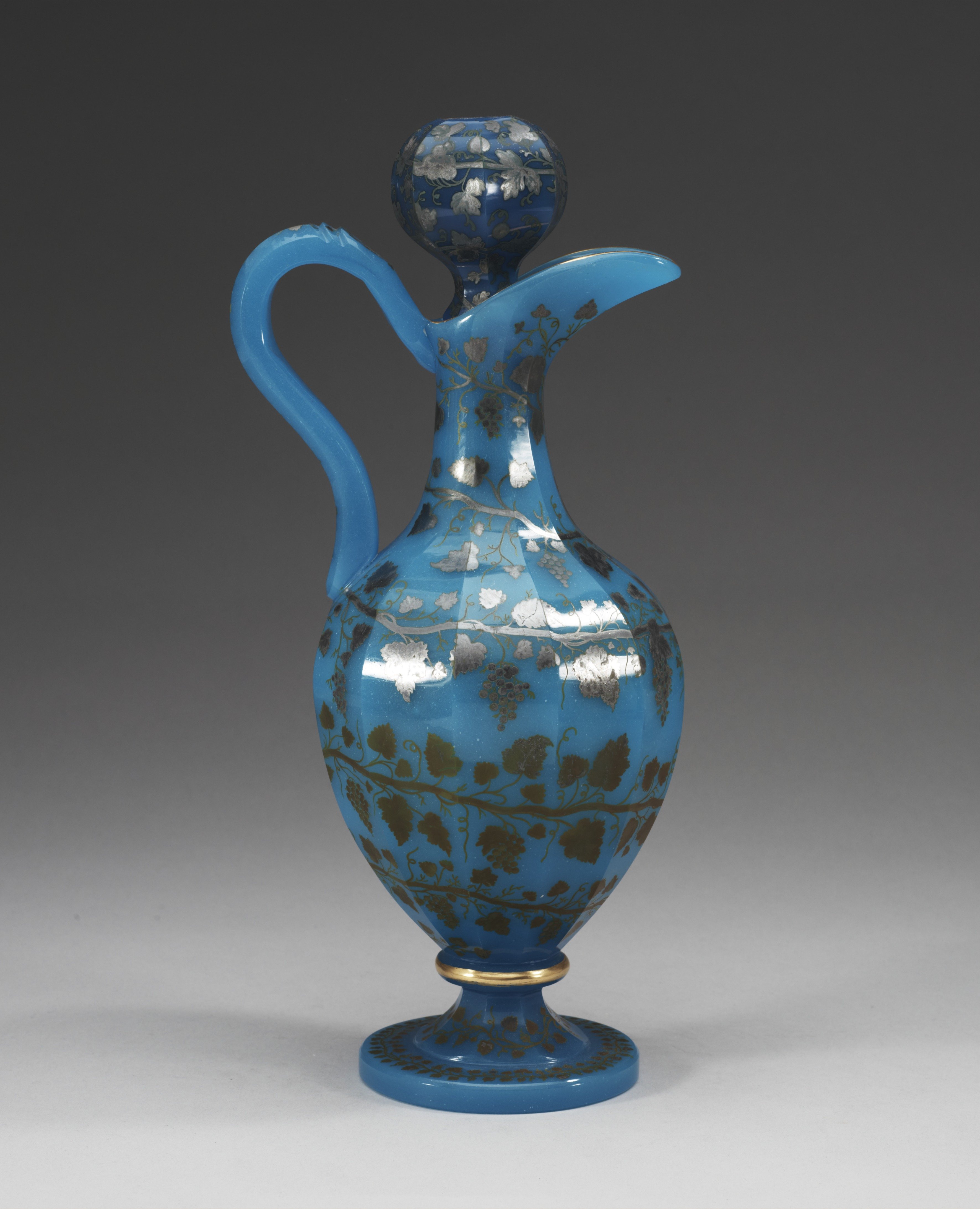 A Russian turquoise glass ewer with stopper, 19th Century. - Bukowskis