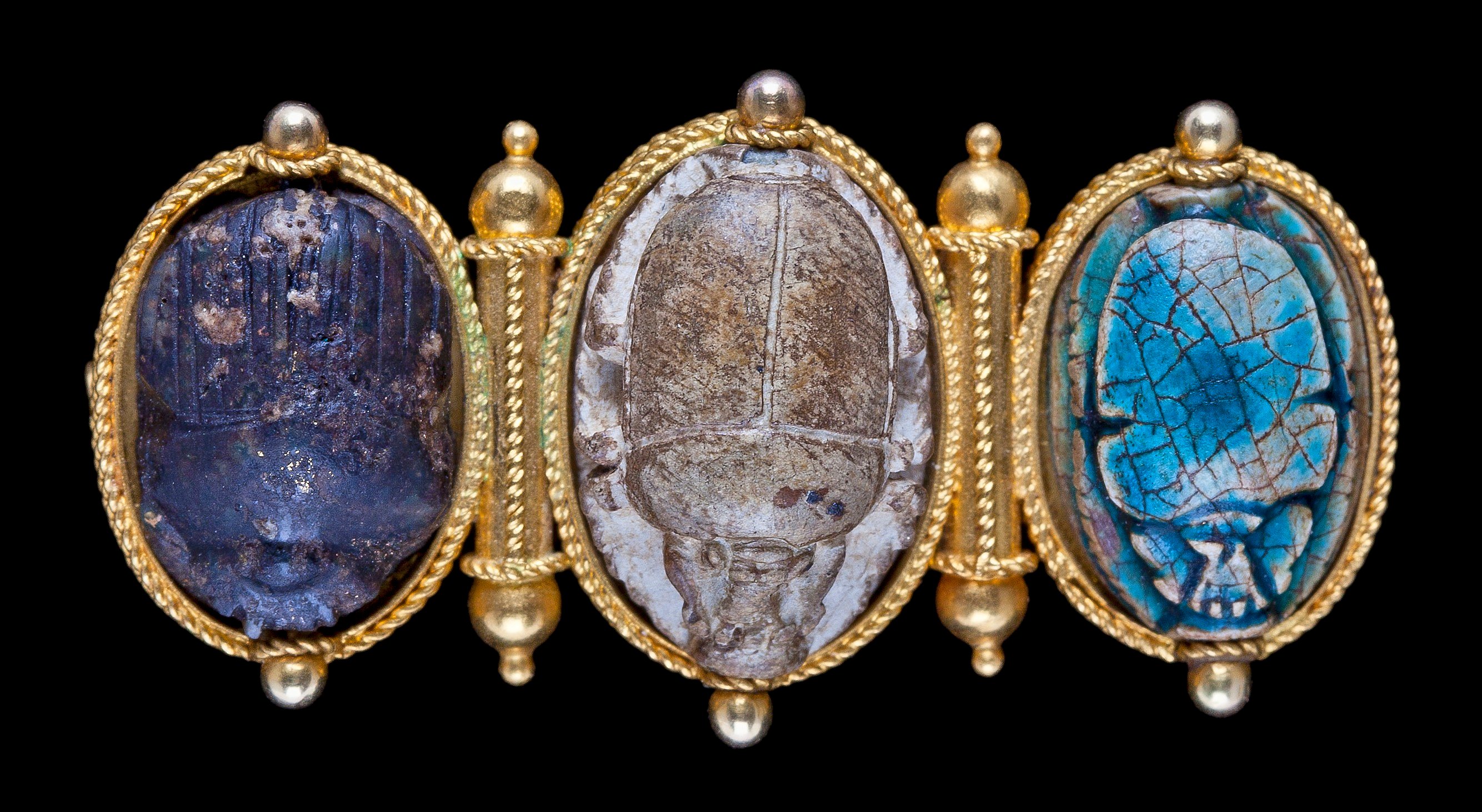 Brooch set with three carved and glazed steatite or ceramic scarab ...