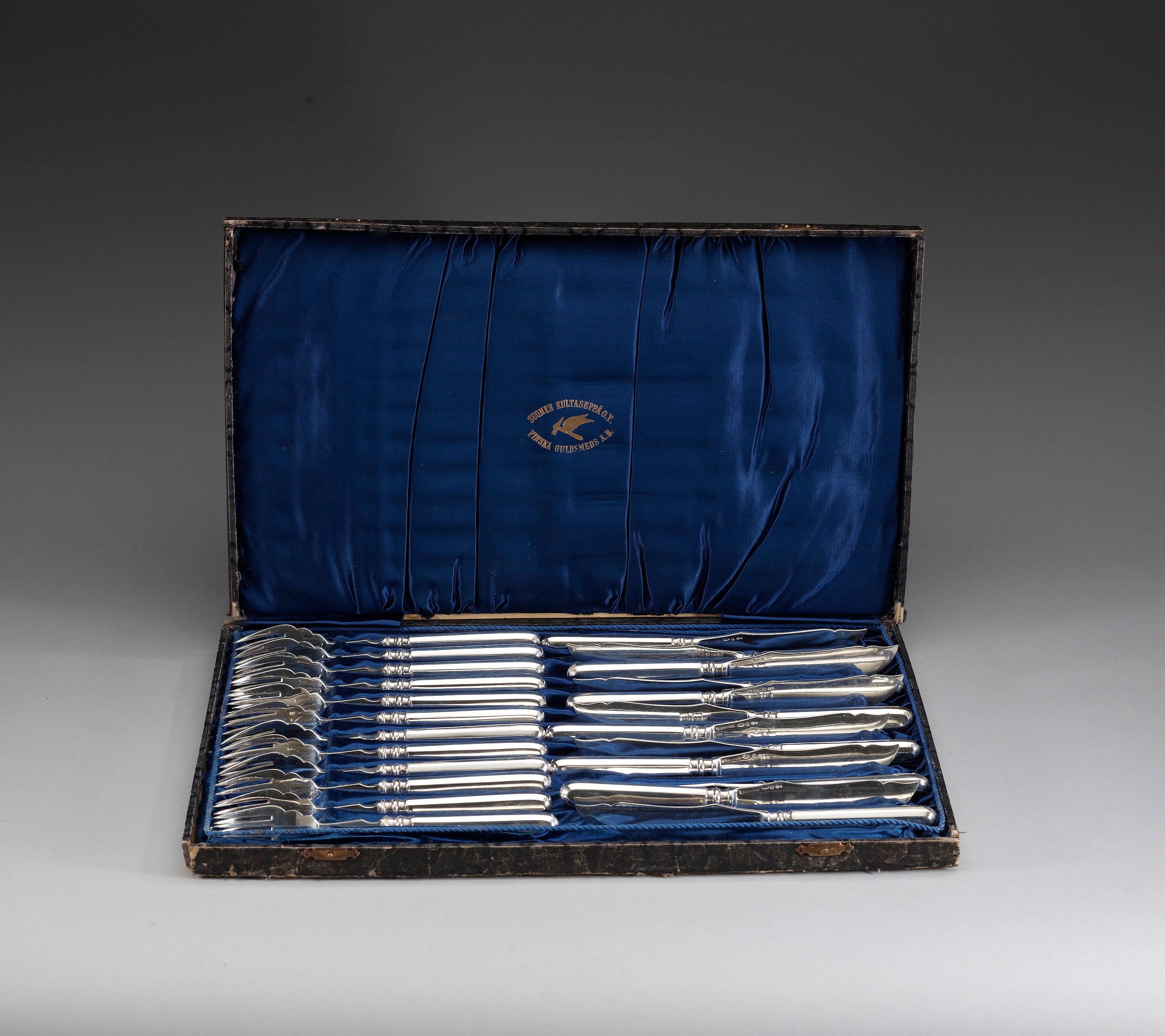 A Russian set of 24 silver fish forks and knivs, makers mark of Mikhail ...
