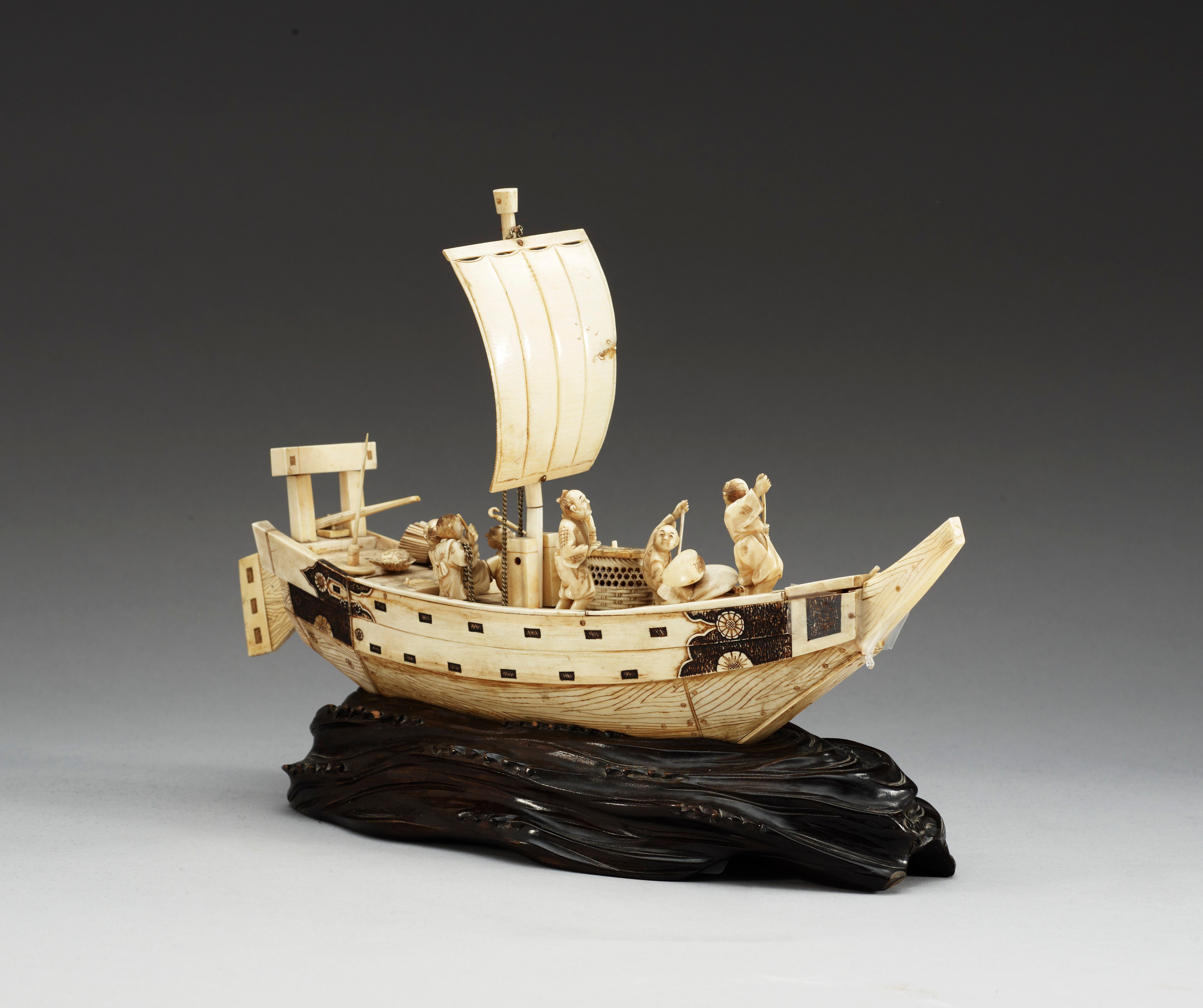 A Japanese ivory model of a ship with fishermen, Meiji period ca 1900 ...