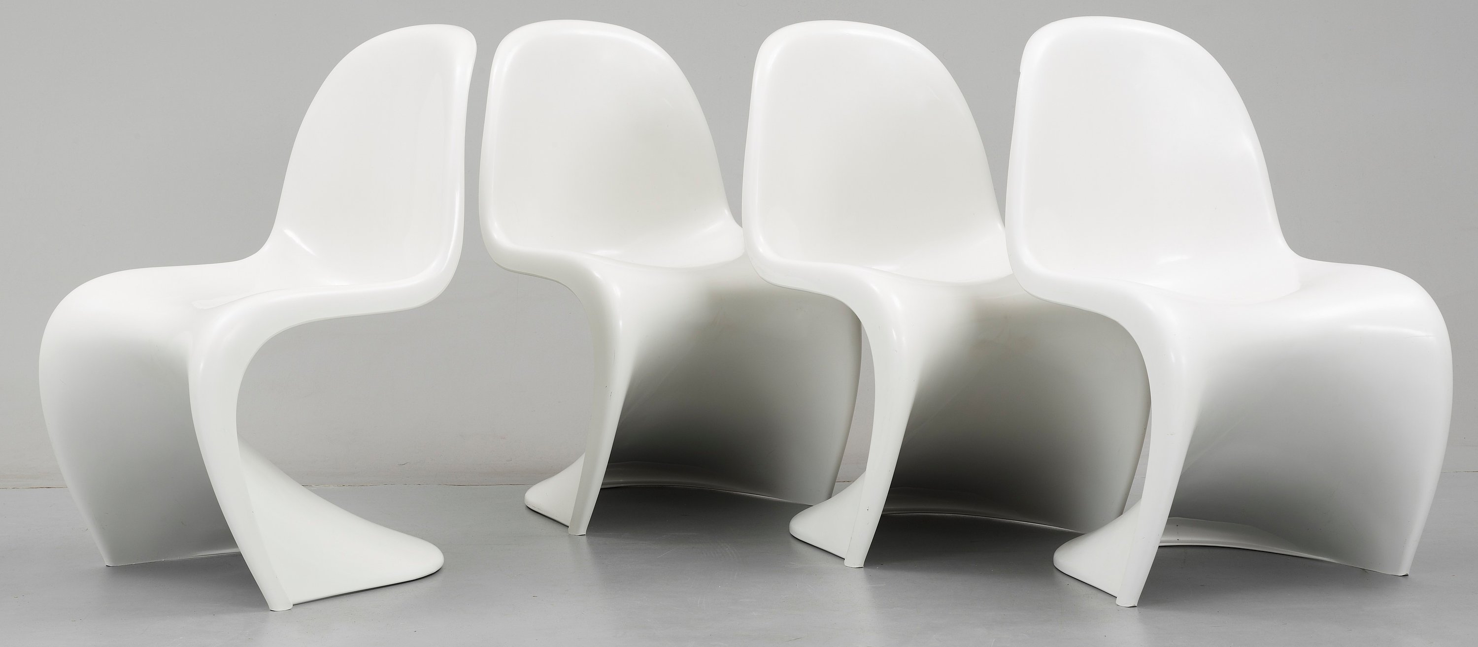 A set of four Verner Panton white plastic chairs 'Panton chair' by ...