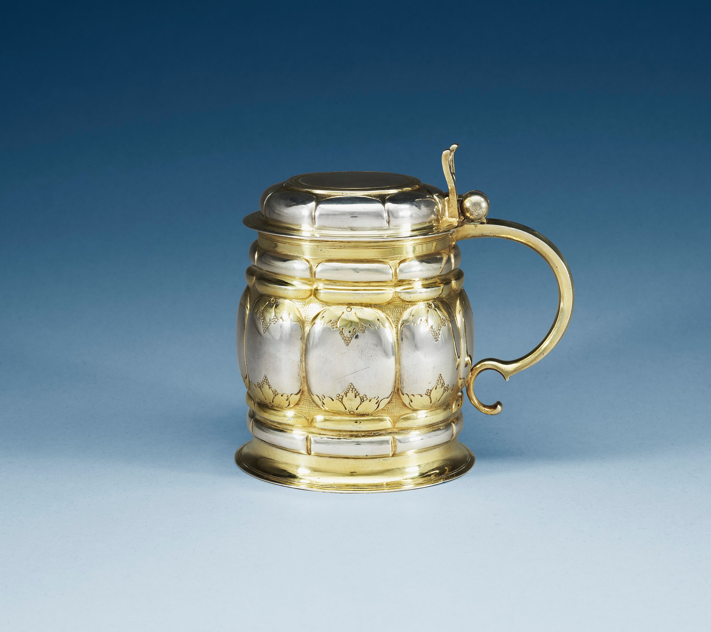 A German 17th century parcel-gilt tankard, makers mark of Paul Solanier ...