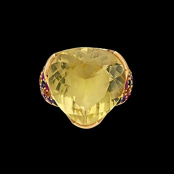 A large citrin ring set with small sapphires, amethysts and tsavorites ...