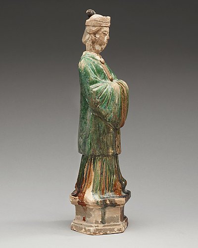 A green glazed pottery figure of a dignitary, Ming dynasty (1368-1644 ...