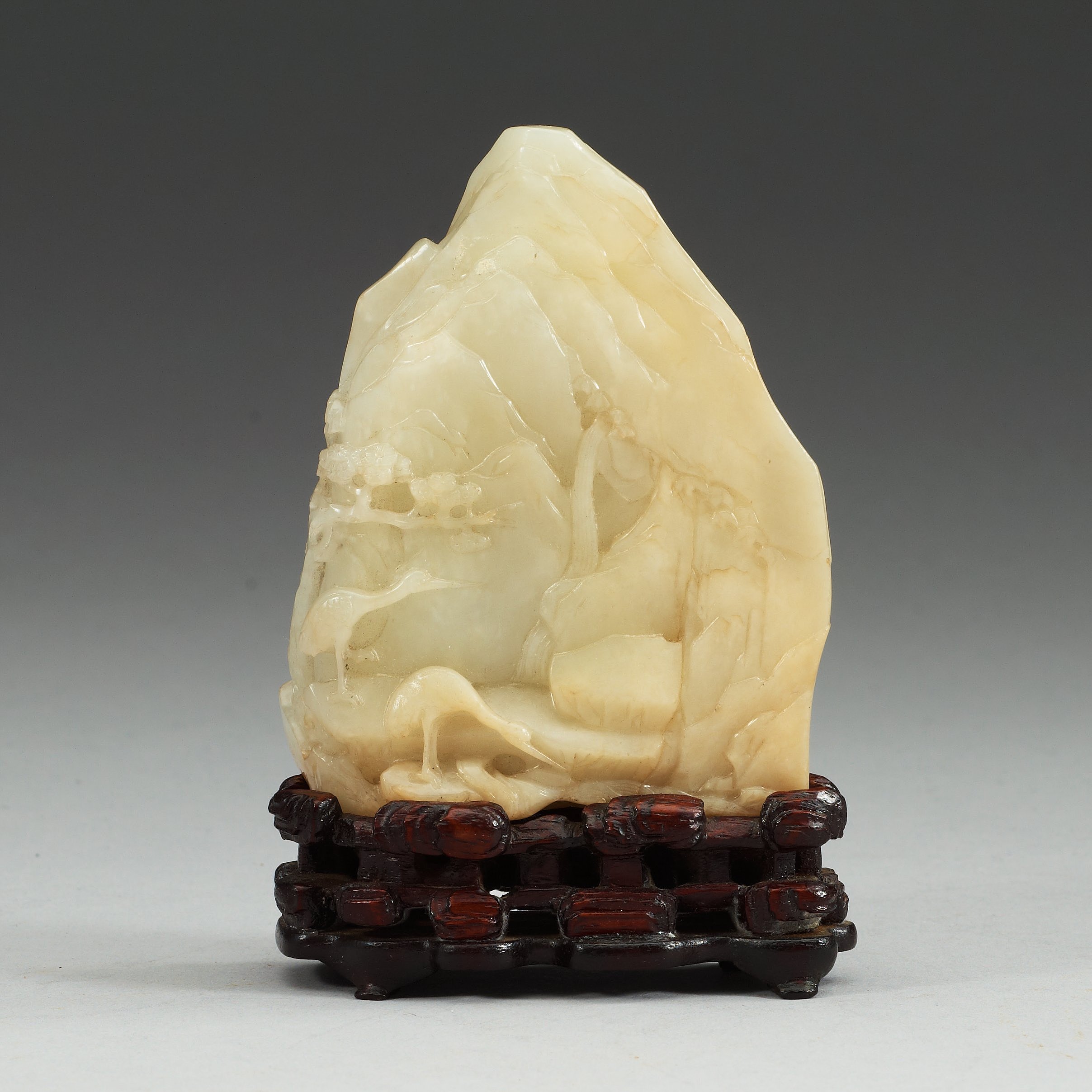 A Chinese nephrite rock carving. - Bukowskis