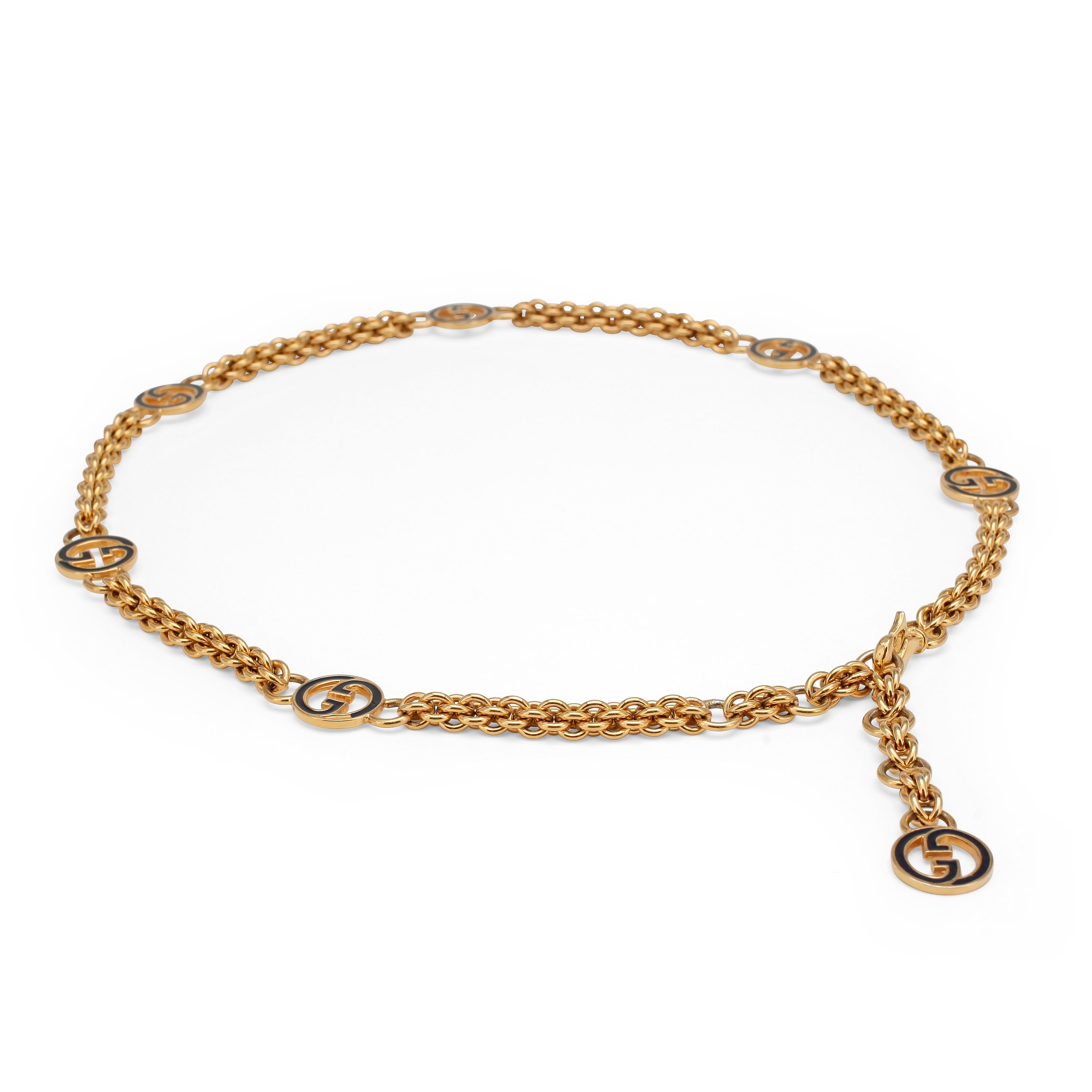 GUCCI, a gold colored mongrammed chain. - Bukowskis