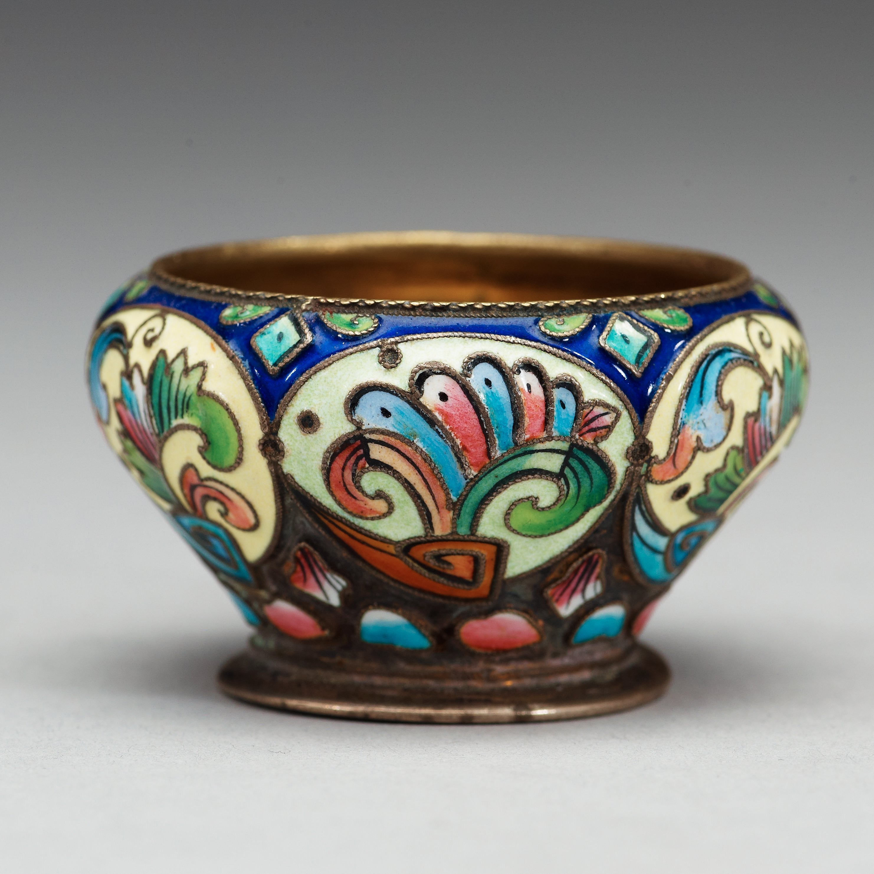 A Russian 19th century silver-gilt and enamel salt, makers mark of the ...