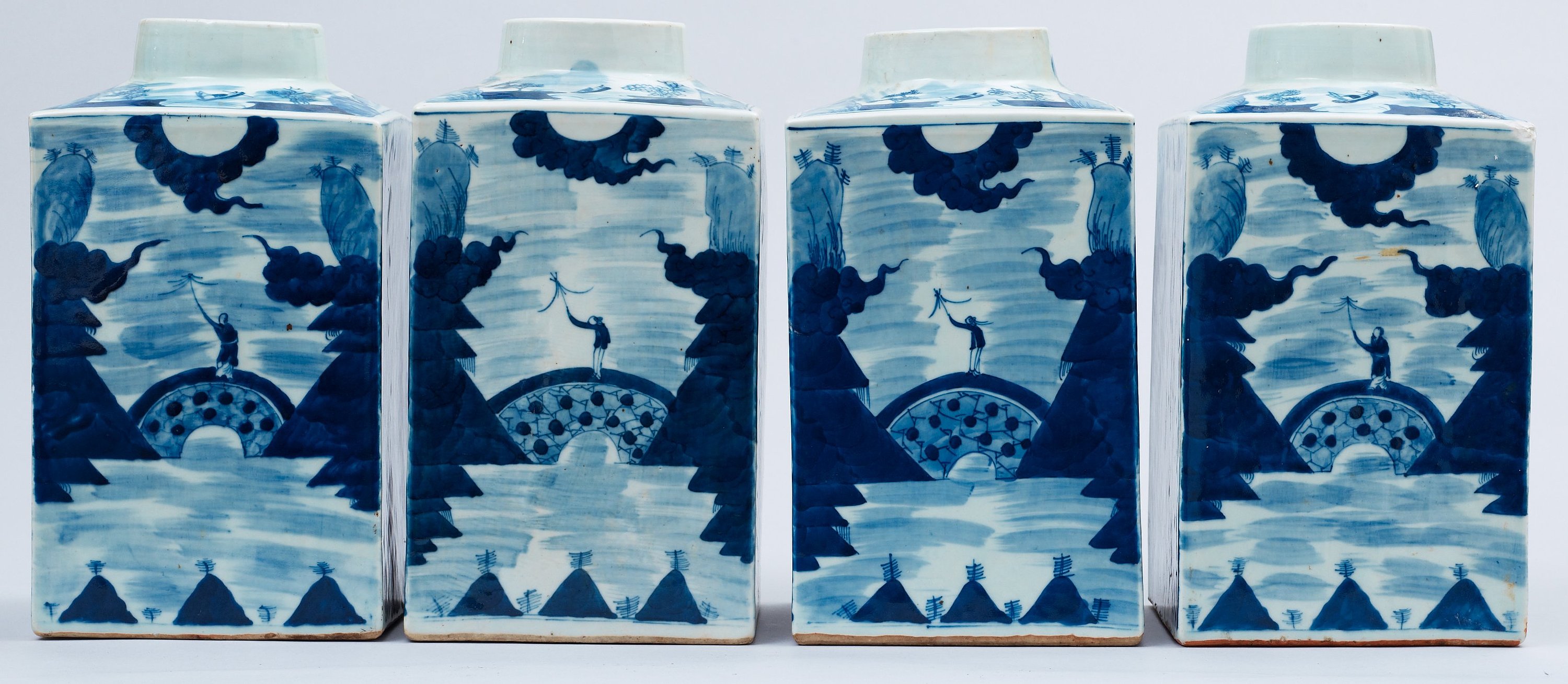 A set of four blue and white large tea caddies in a wooden box, Qing ...