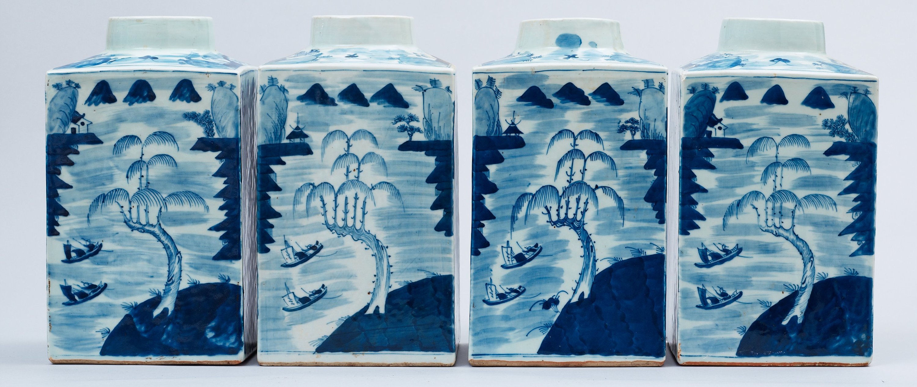 A set of four blue and white large tea caddies in a wooden box, Qing ...