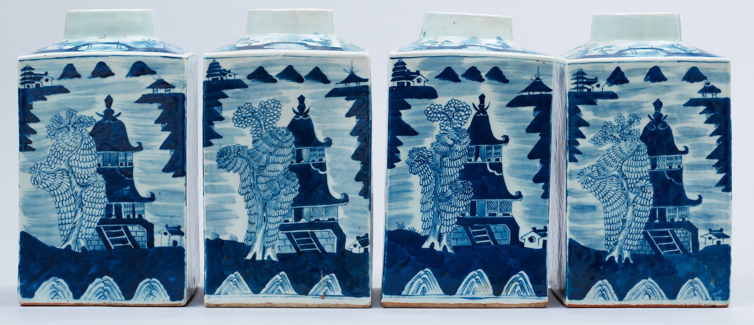 A set of four blue and white large tea caddies in a wooden box, Qing ...