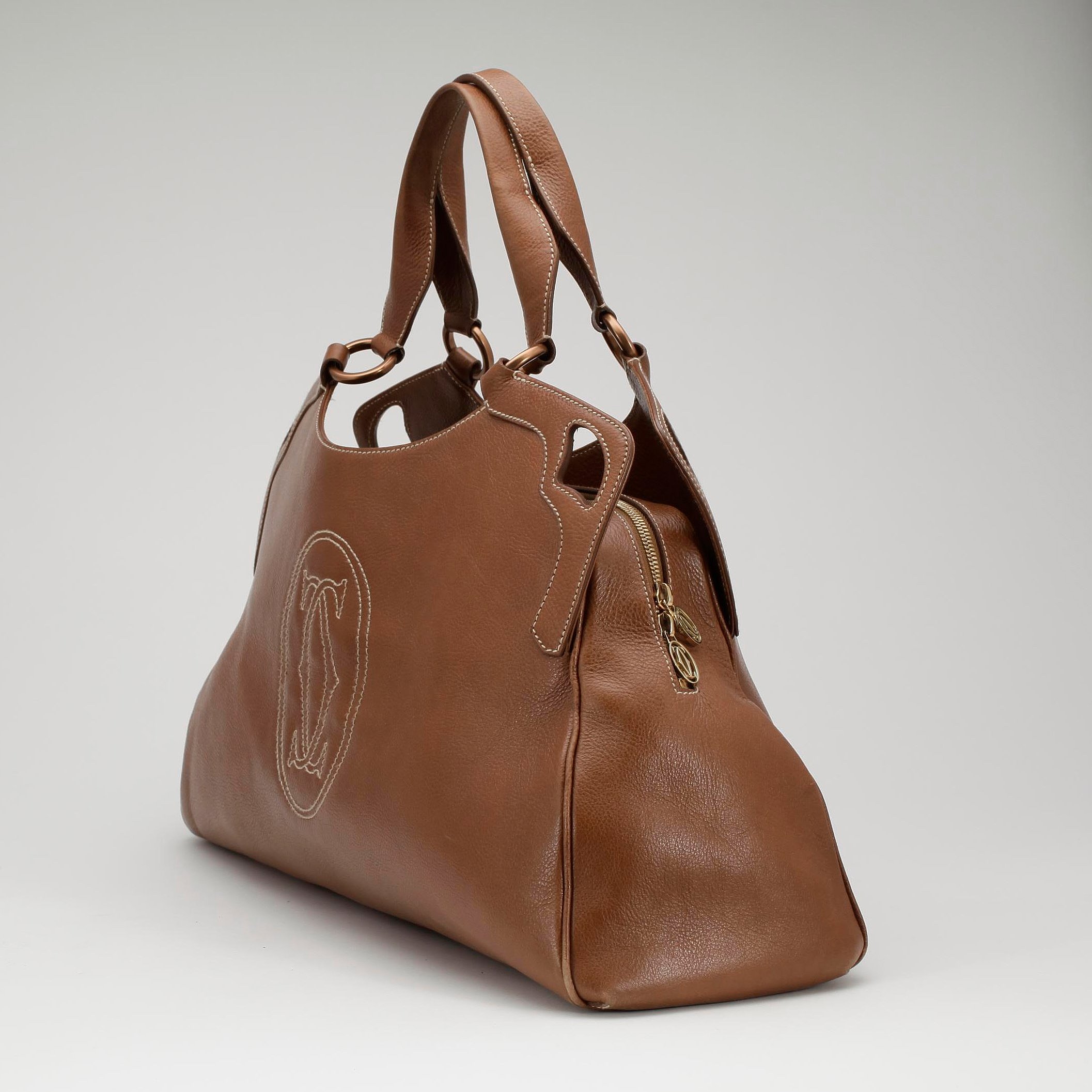 CARTIER, a brown leather bag. - Bukowskis