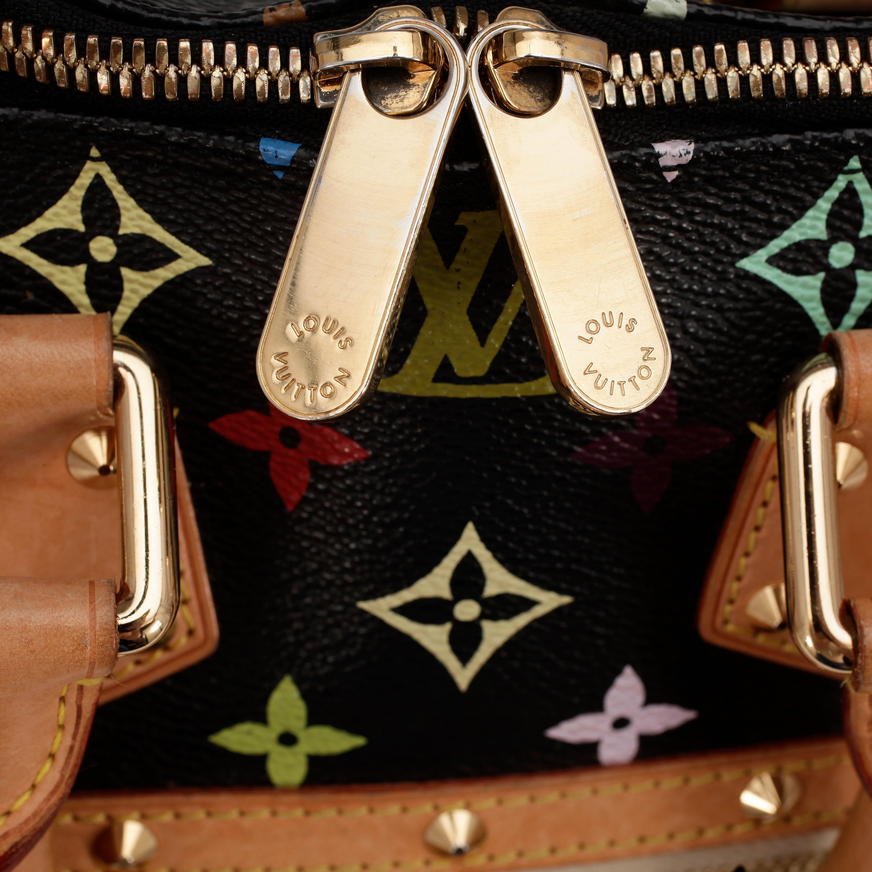 LOUIS VUITTON, a black multicolored mongram canvas "Alma" top handle ...
