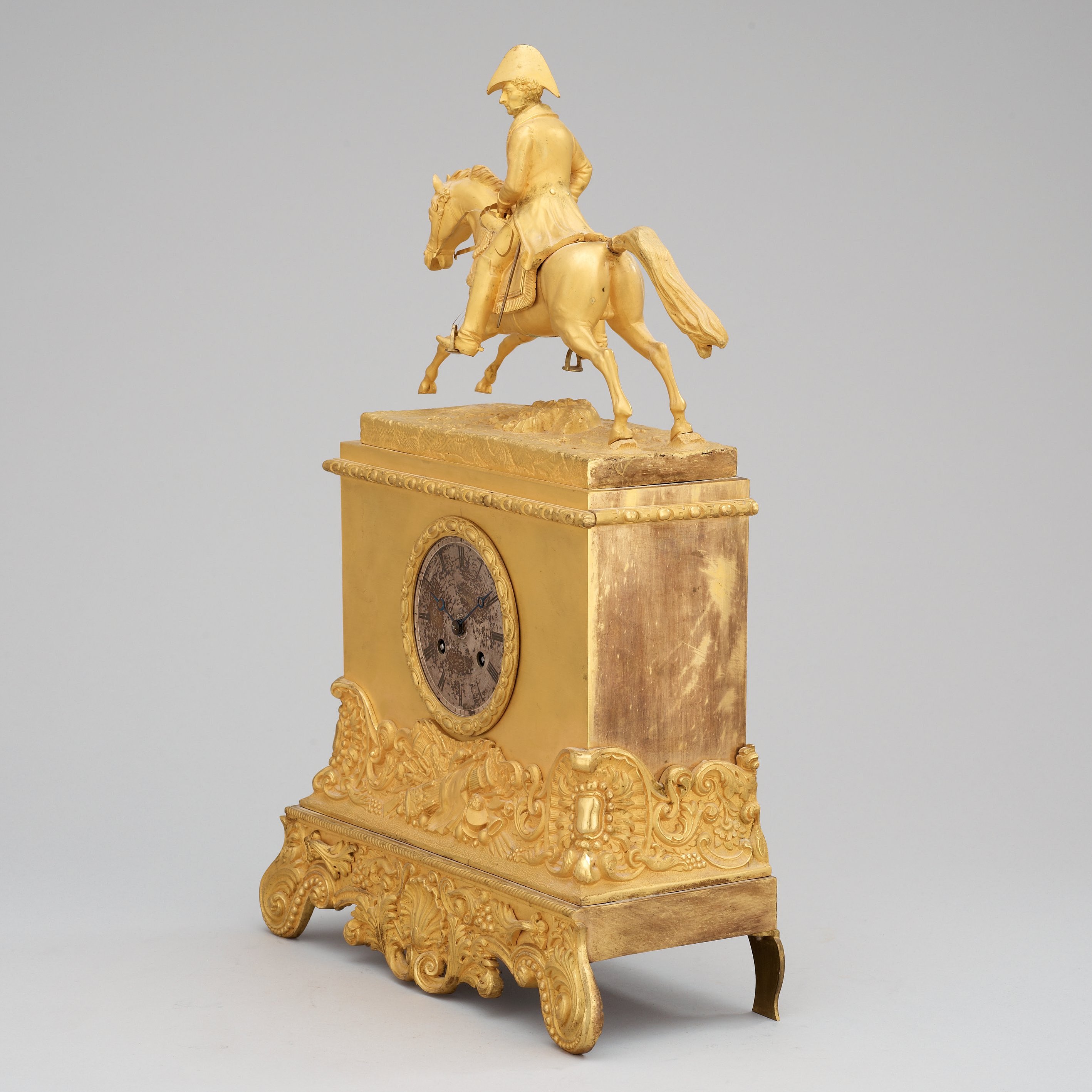 A Swedish Empire Equestrian gilt bronze mantel clock depicting king ...
