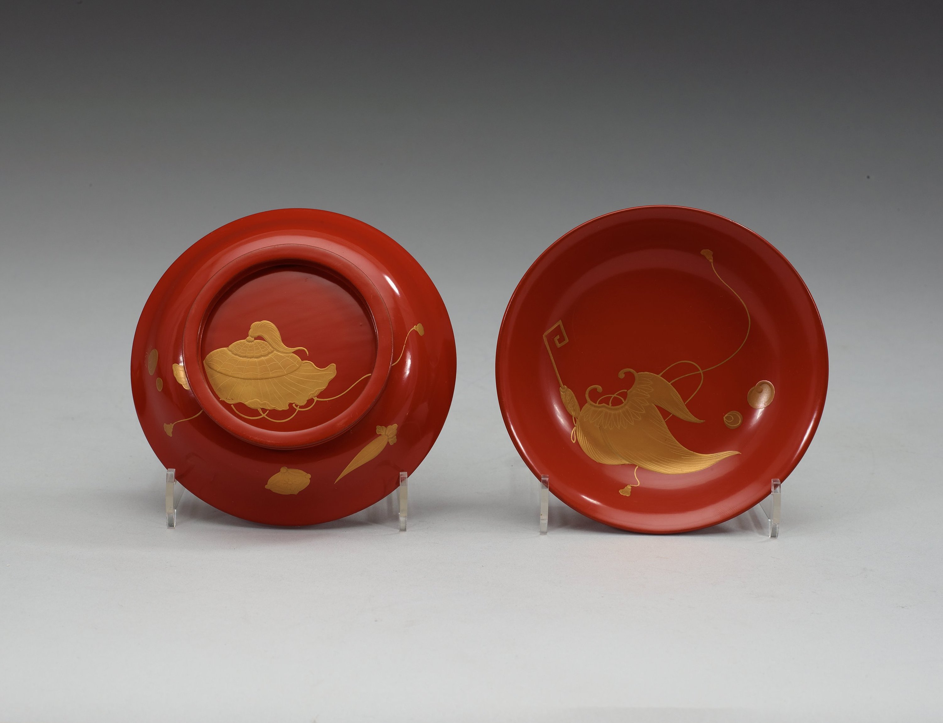 A set of eight red lacquered Japanese bowls with covers, first half of ...