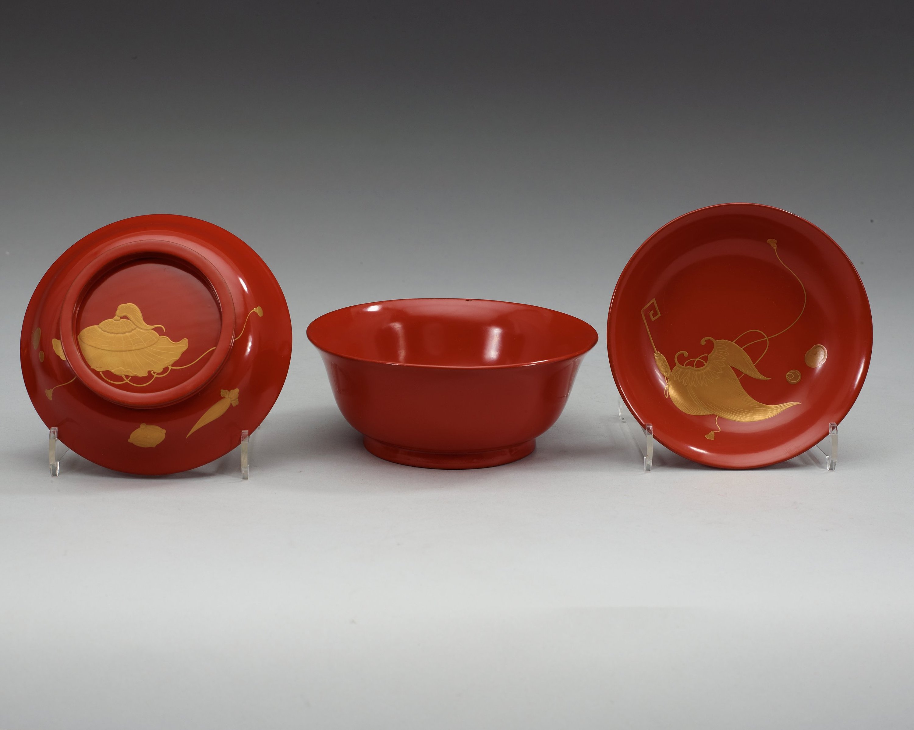 A set of eight red lacquered Japanese bowls with covers, first half of ...