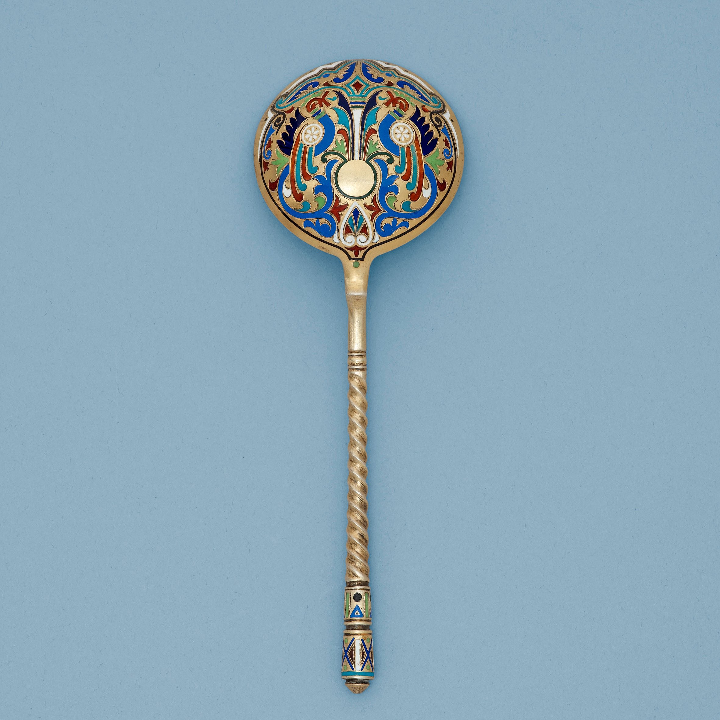 A Russian 19th century silver-gilt and enamel caviar-spoon, marks of ...
