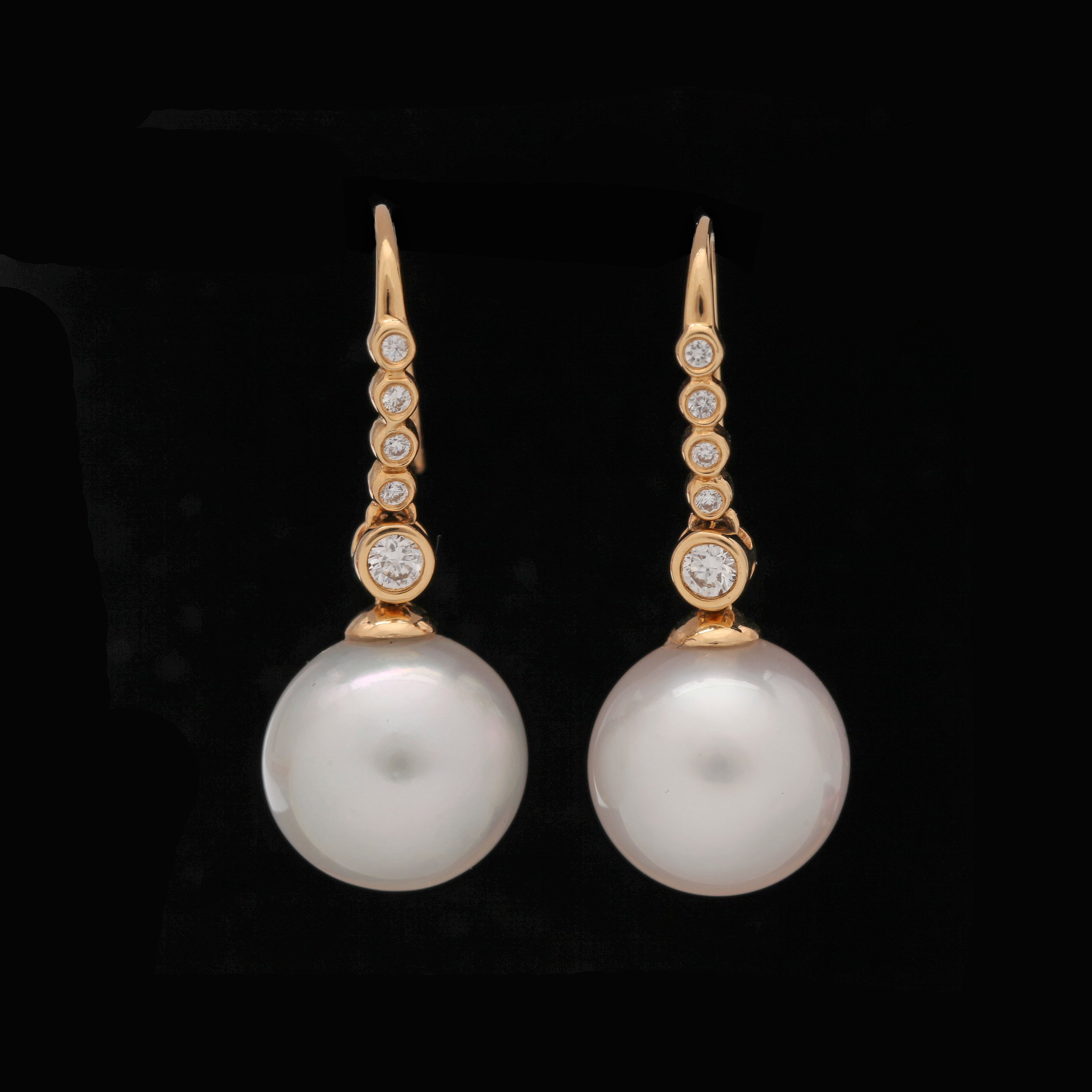 A pair of cultured South sea pearl earrings set with brilliant-cut ...