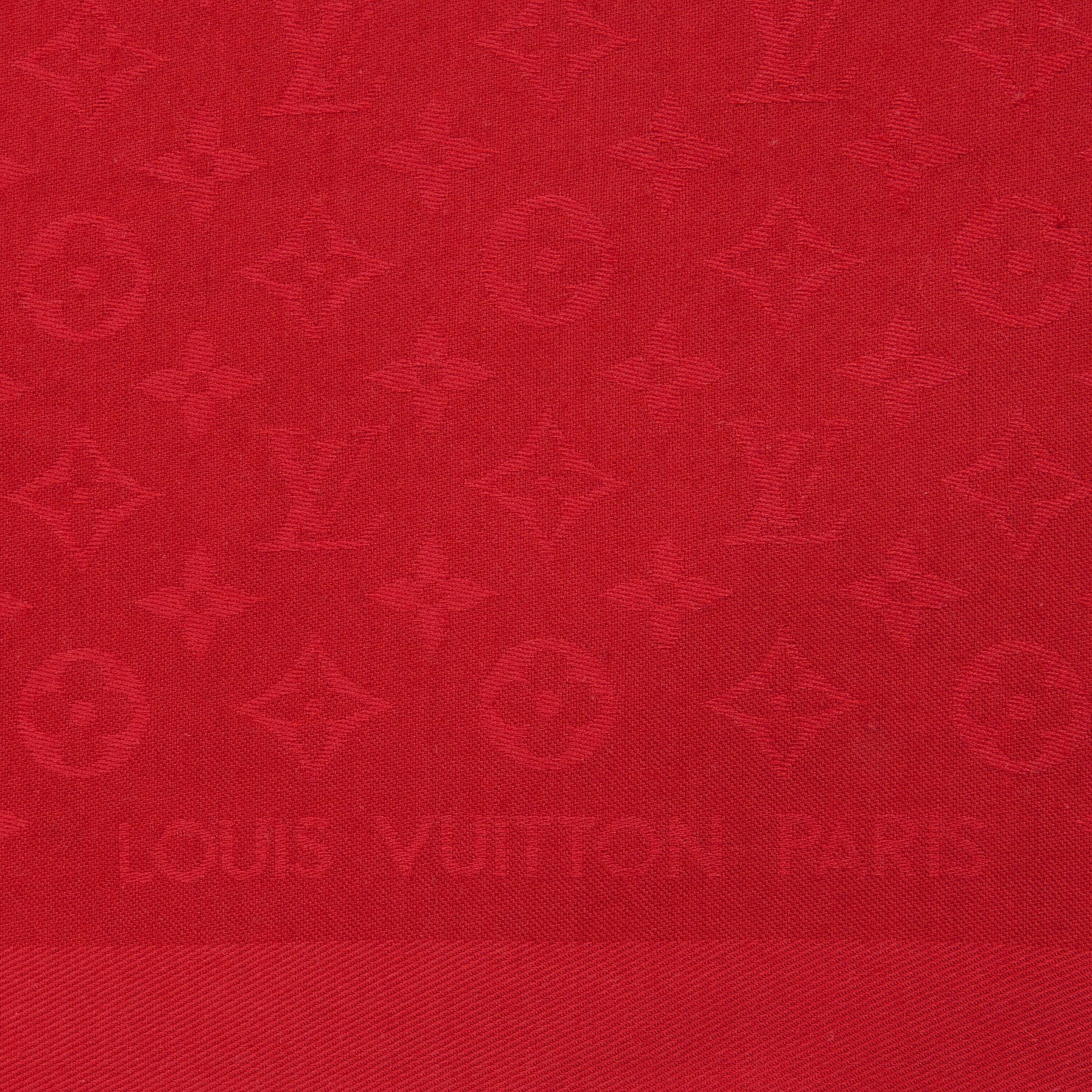 LOUIS VUITTON, a burgundy red monogrammed wool and silk shawl. - Bukowskis