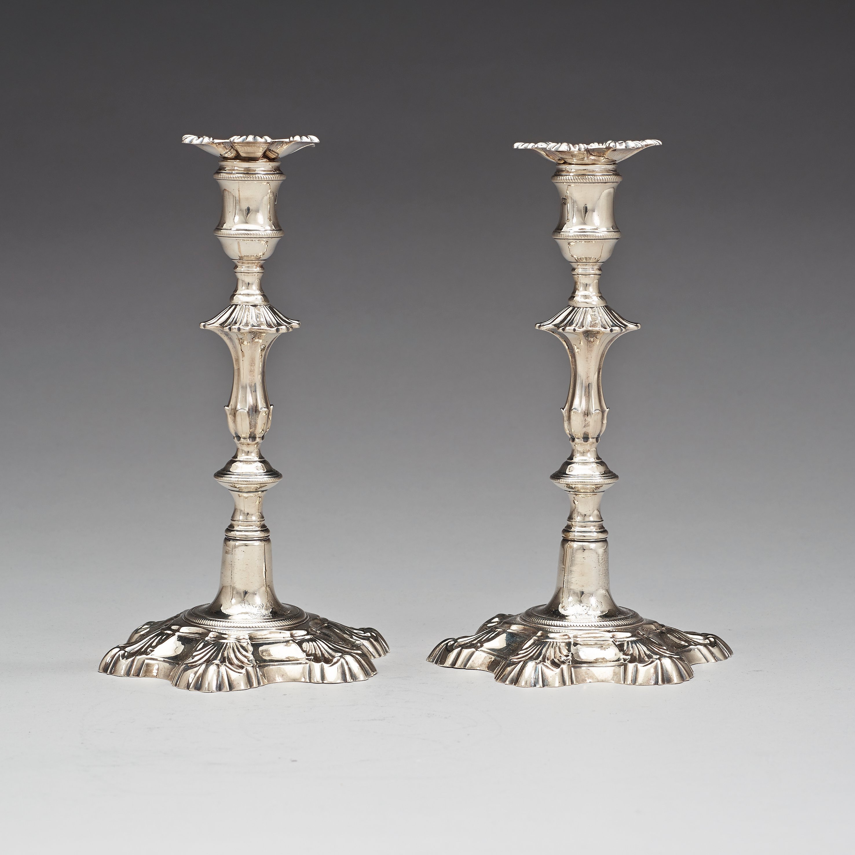 A pair of English mid 18th century silver candlesticks, marks of John ...