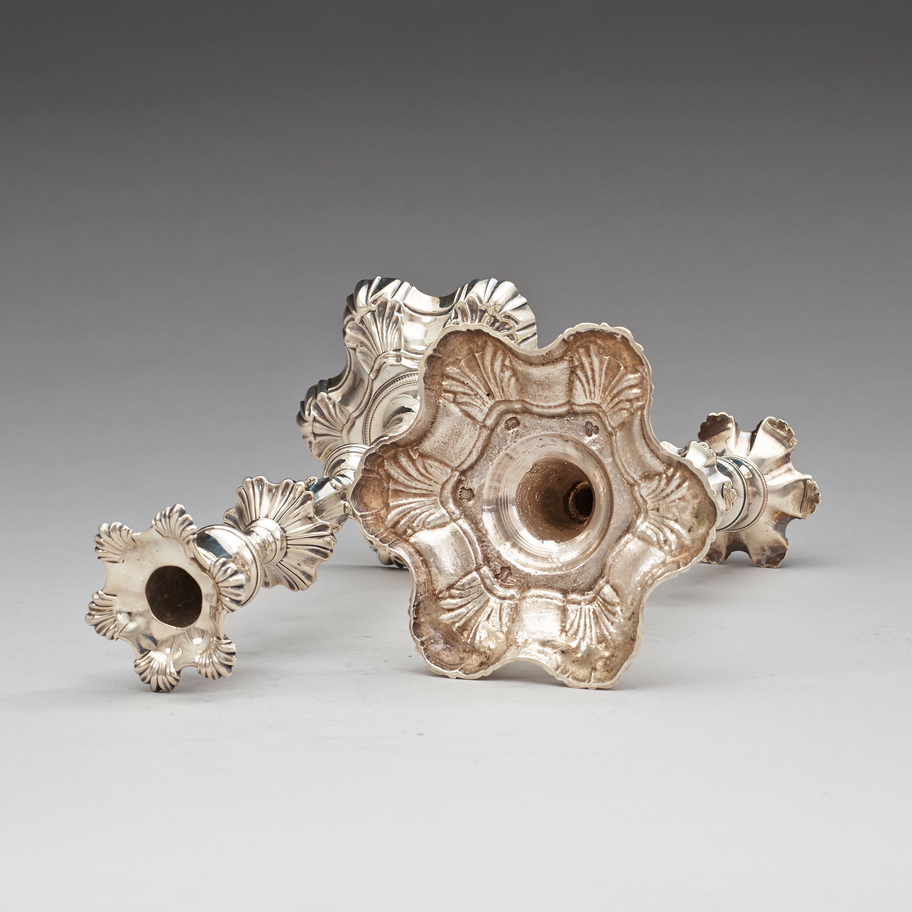 A pair of English mid 18th century silver candlesticks, marks of John ...